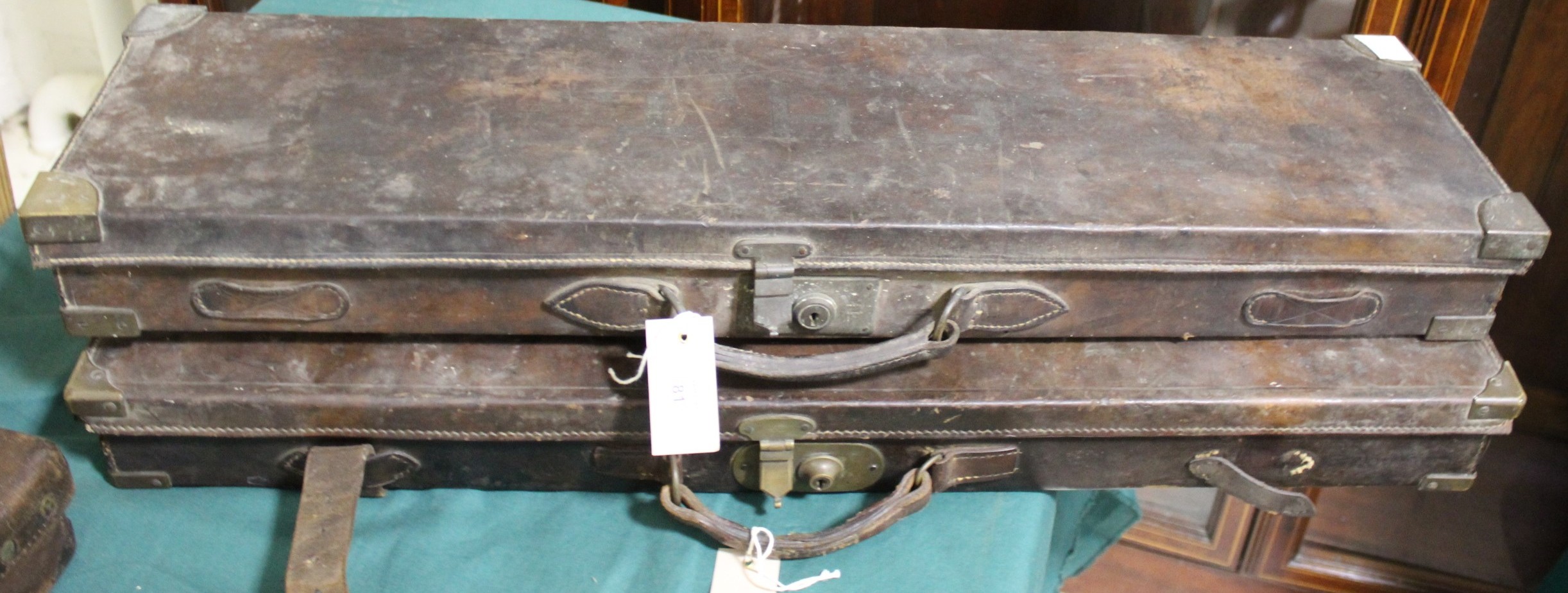 VINTAGE LEATHER GUN CASES 2 vintage leather gun cases, both with ...