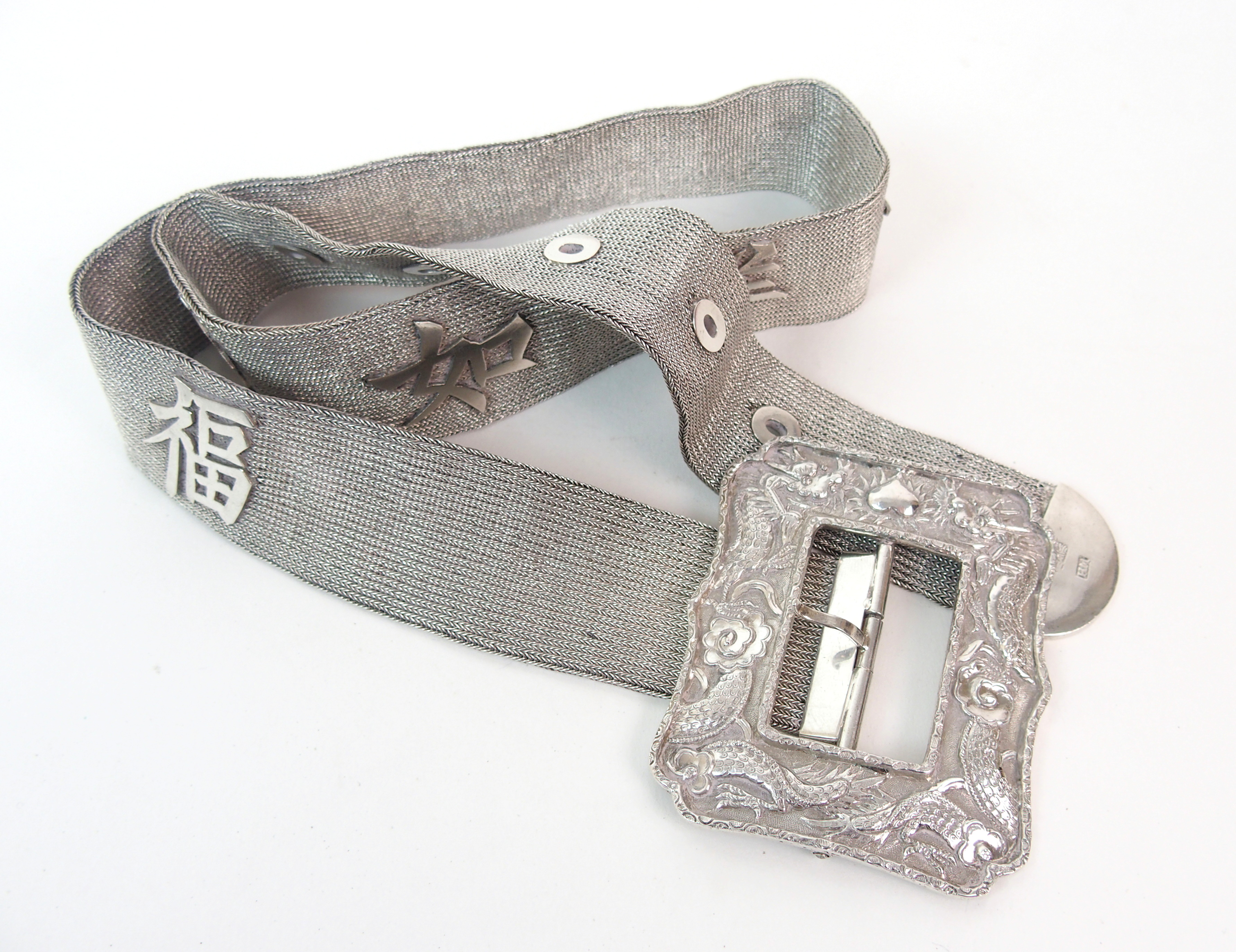 A Chinese silver mesh belt applied with shou characters, the buckle ...