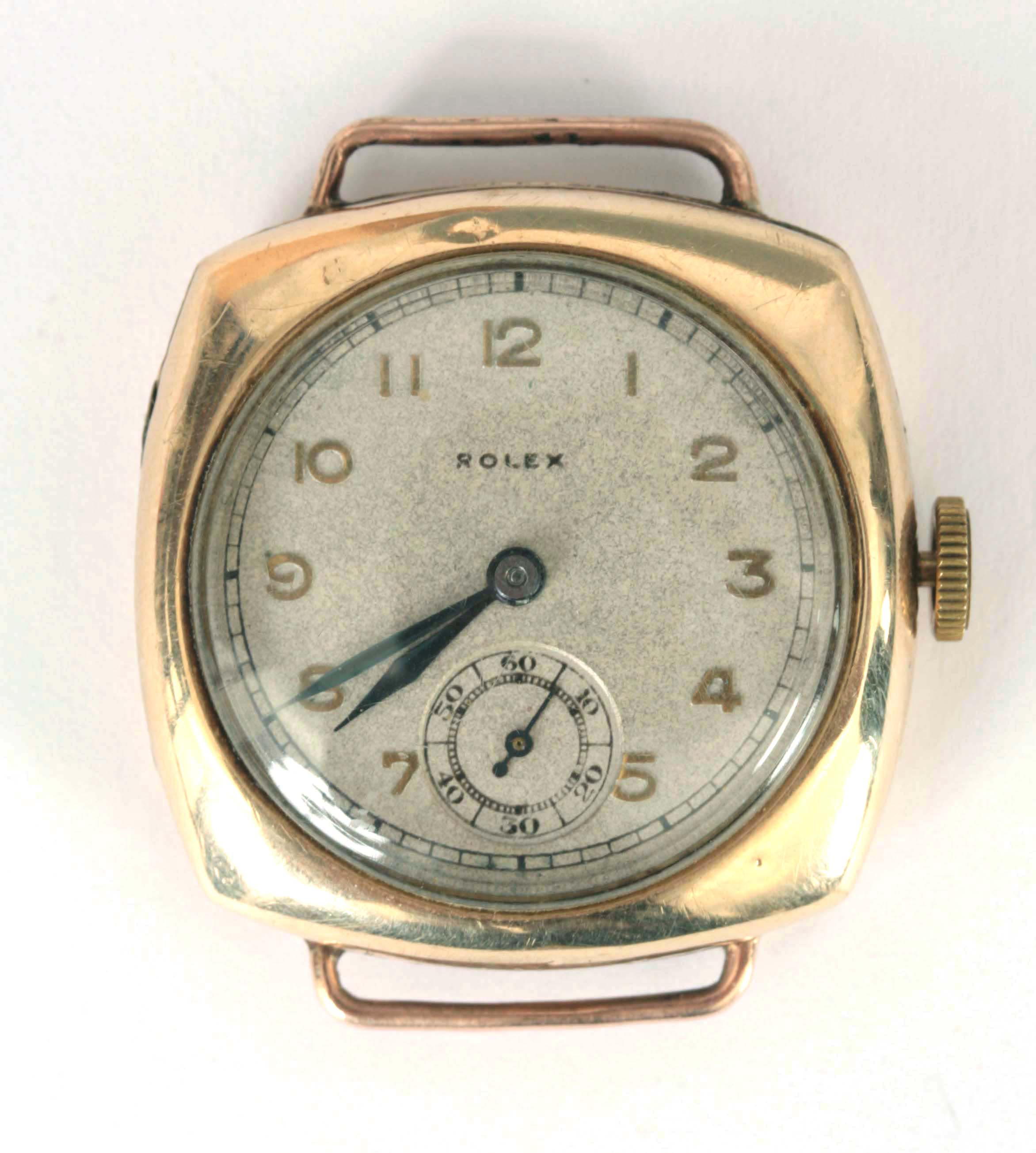 A VINTAGE 9K GOLD ROLEX WRIST WATCH the square case with curved sides ...
