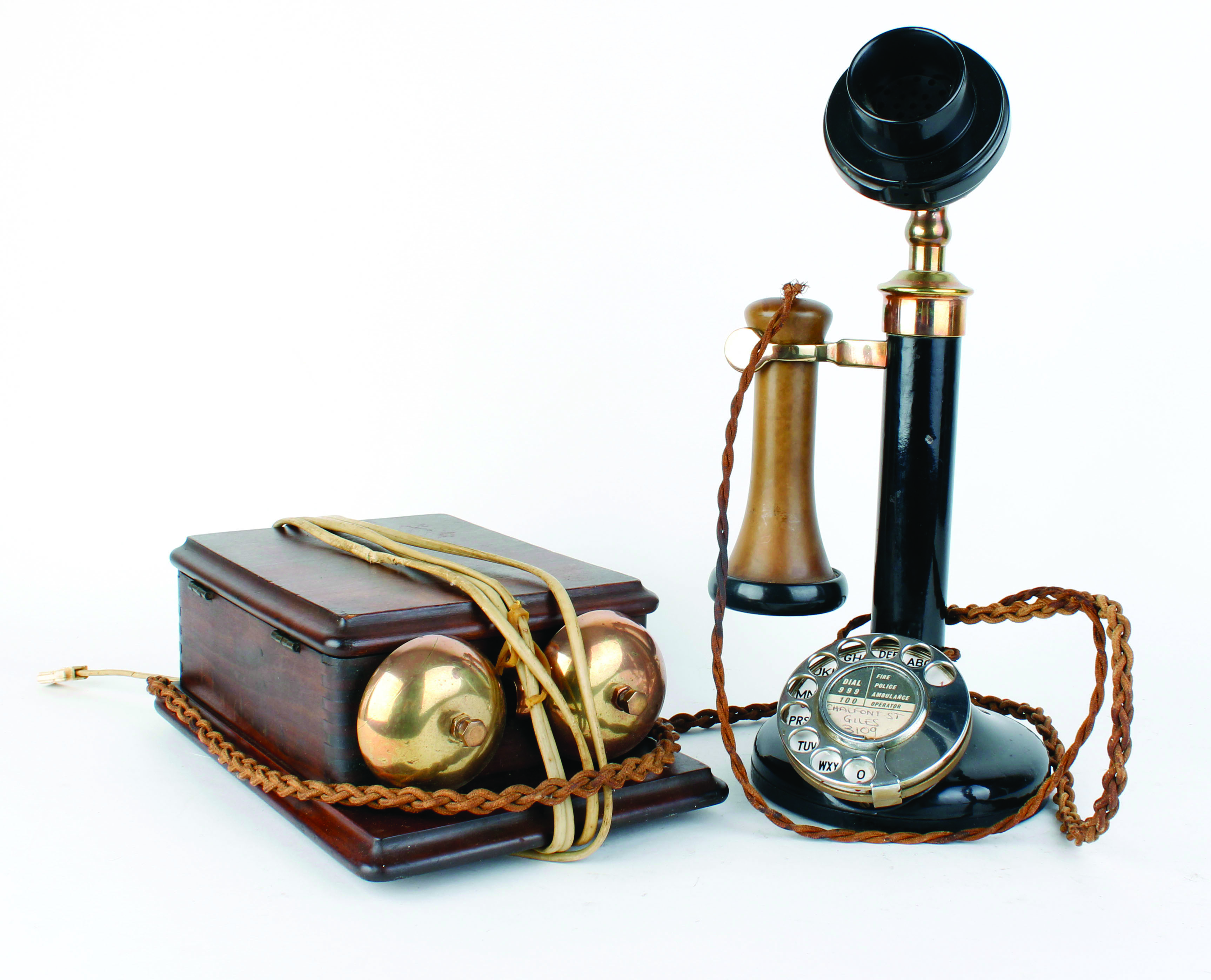 An early 20th century brass and bakelite candlestick telephone, marked ...