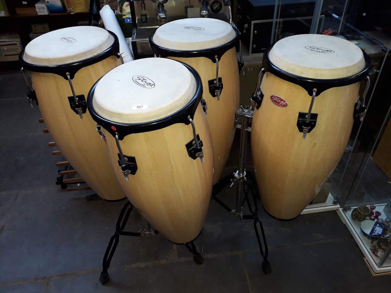 Two sets of Stagg conga drums on stands.