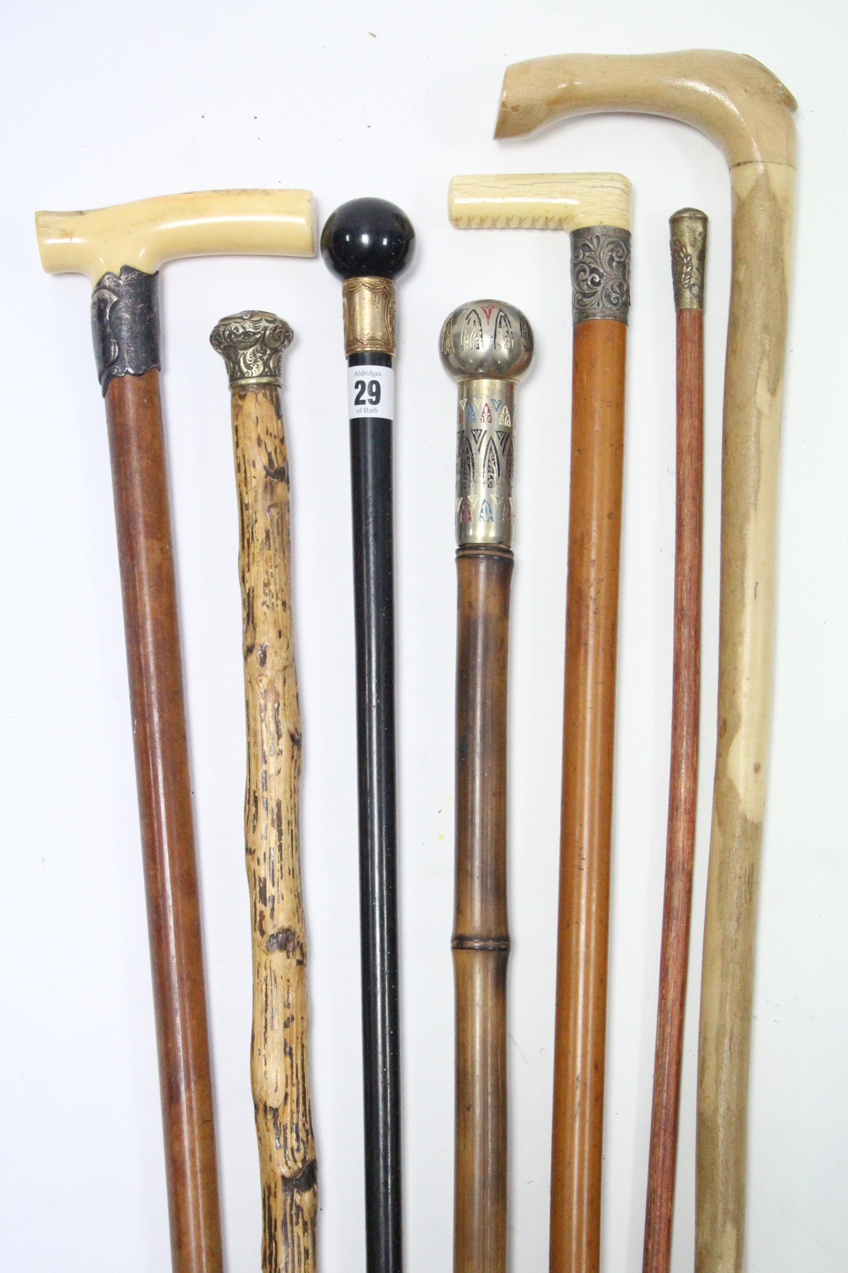 An Edwardian ebonised gent’s walking cane with 18ct. gold plated mount ...
