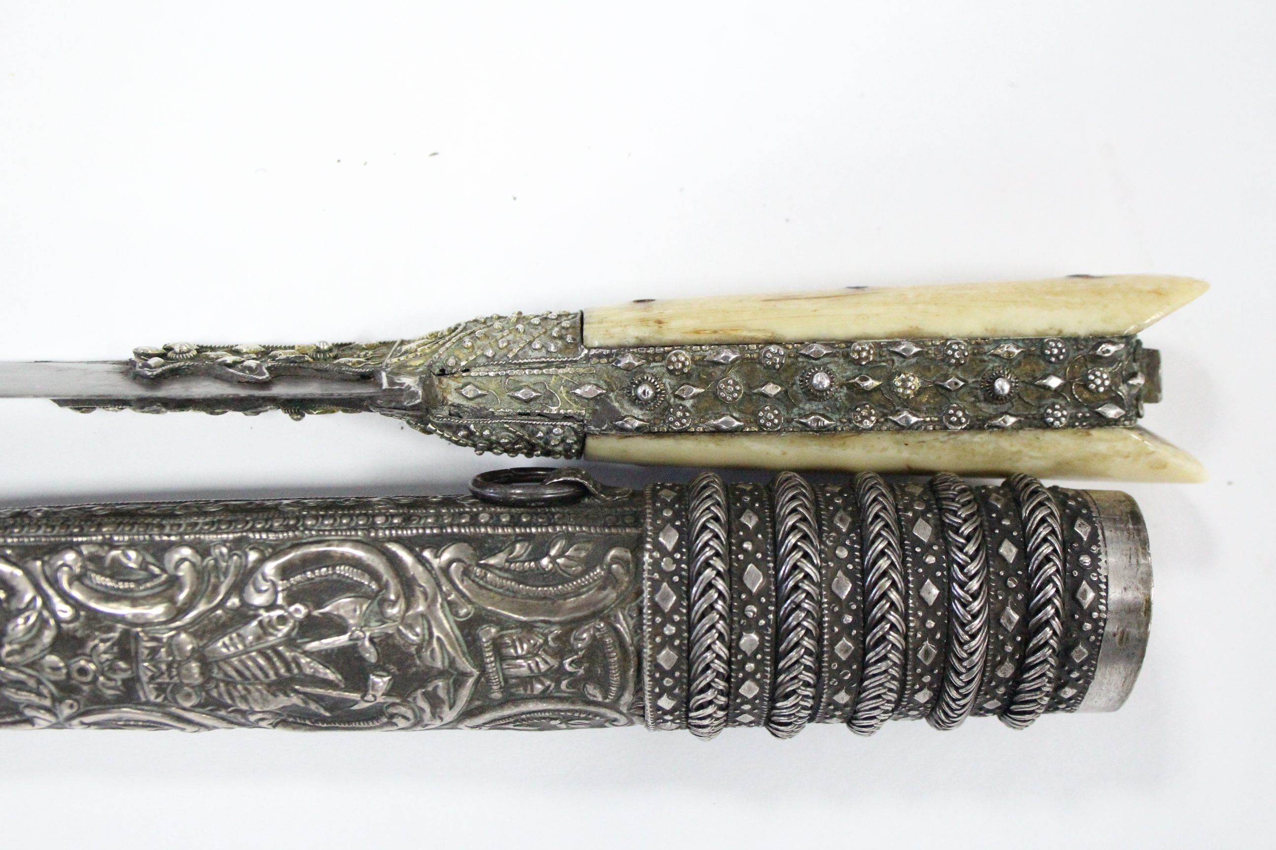 A PERSIAN CEREMONIAL DAGGER, the steel blade with gilt inscription ...