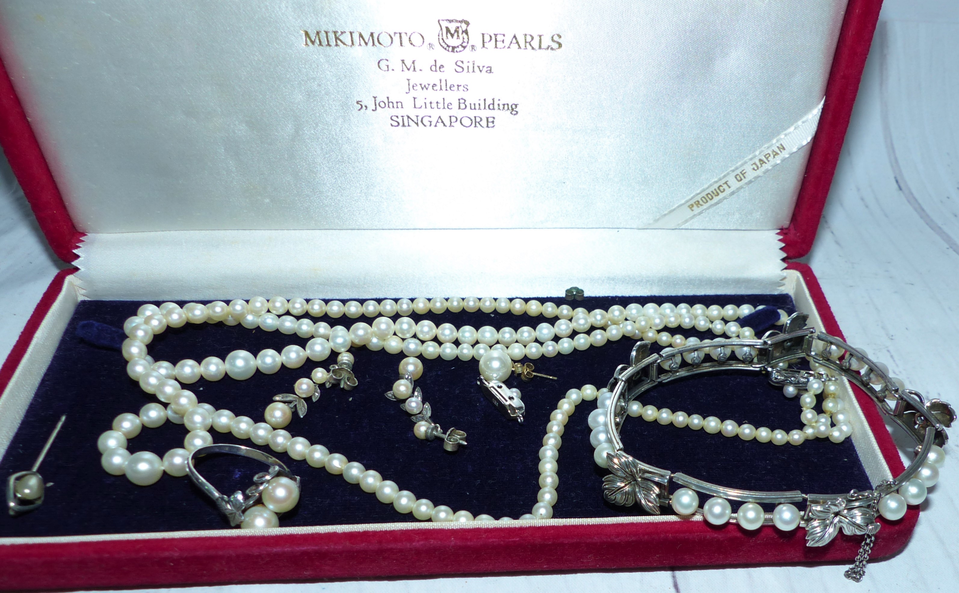 A Mikimoto box containing cultured pearl jewellery including ring and ...