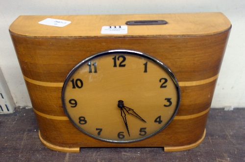 An Art Deco walnut two-florin coin operated clock