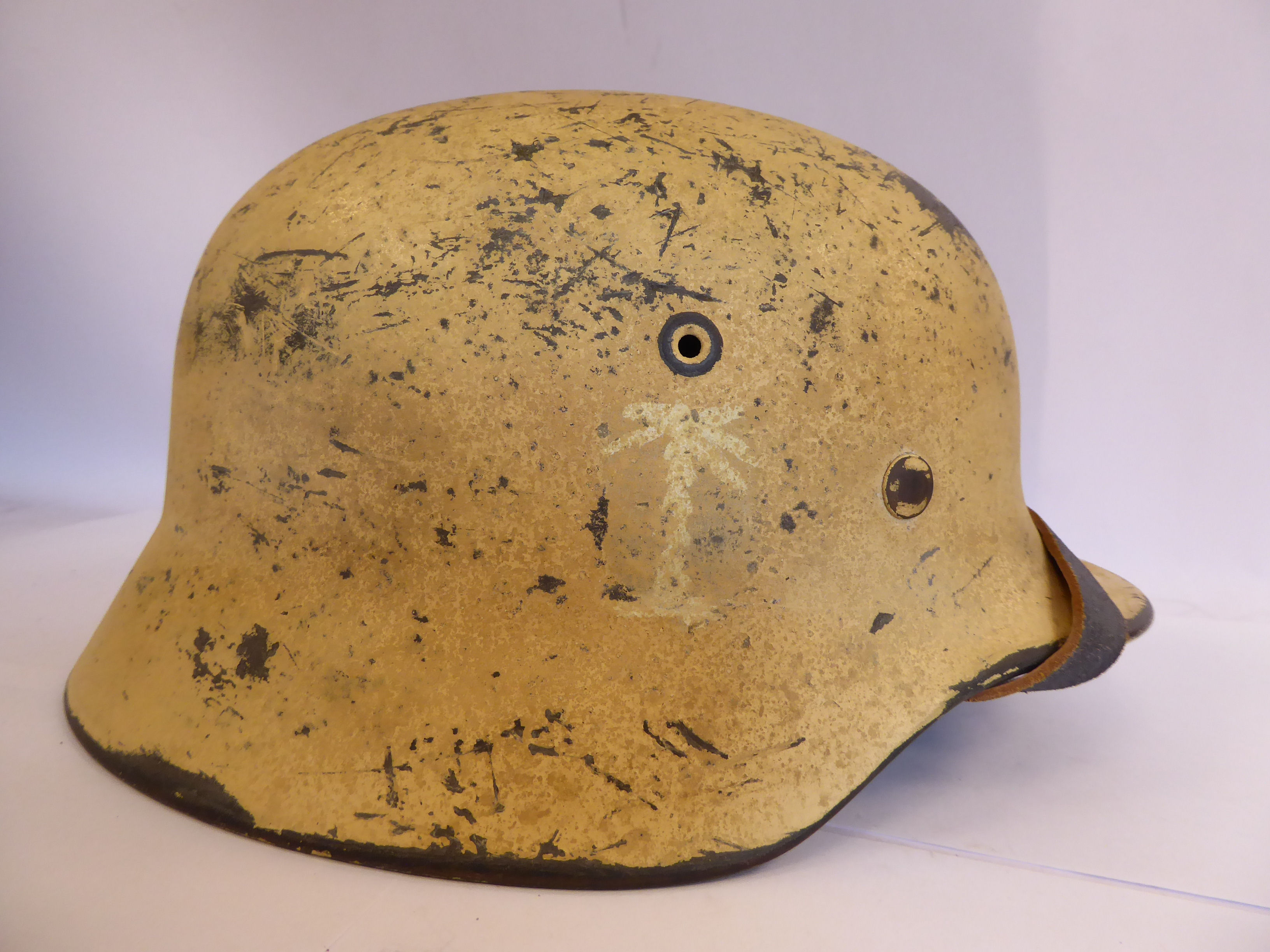 A World War II German Army steel helmet, in sand colour for desert use ...