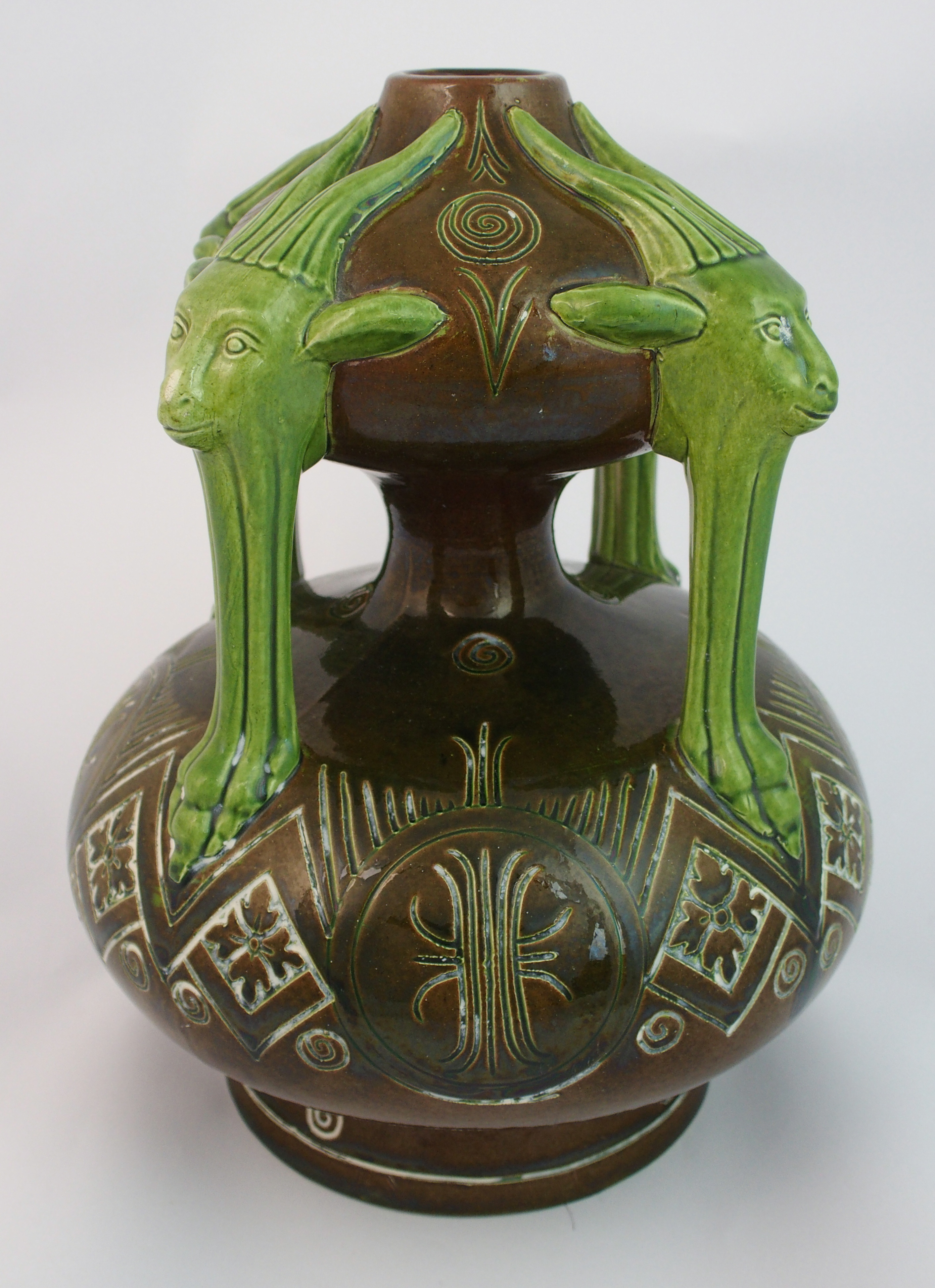 A rare Christopher Dresser "Goats Head" pottery vase designed for ...