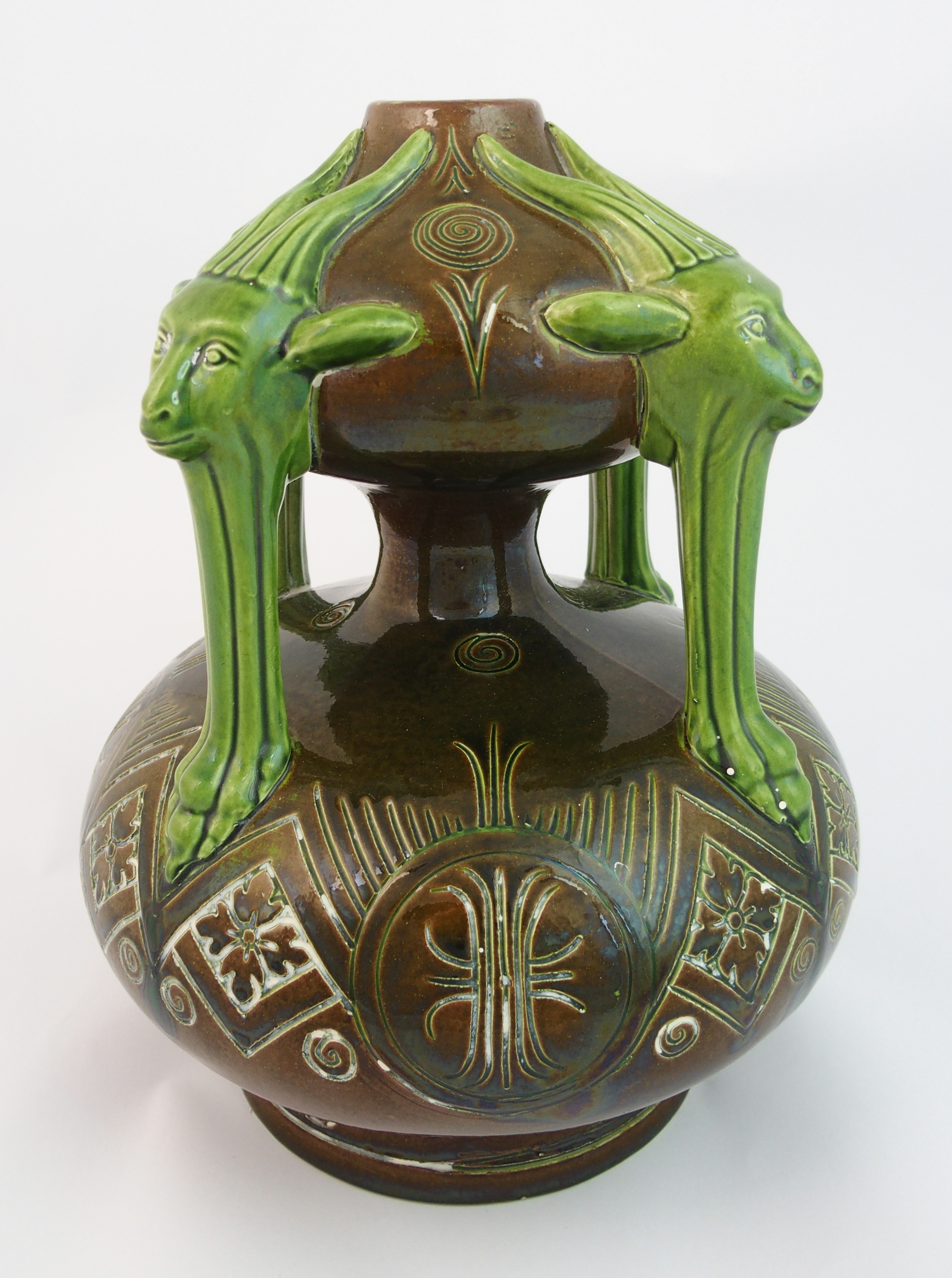A rare Christopher Dresser "Goats Head" pottery vase designed for ...
