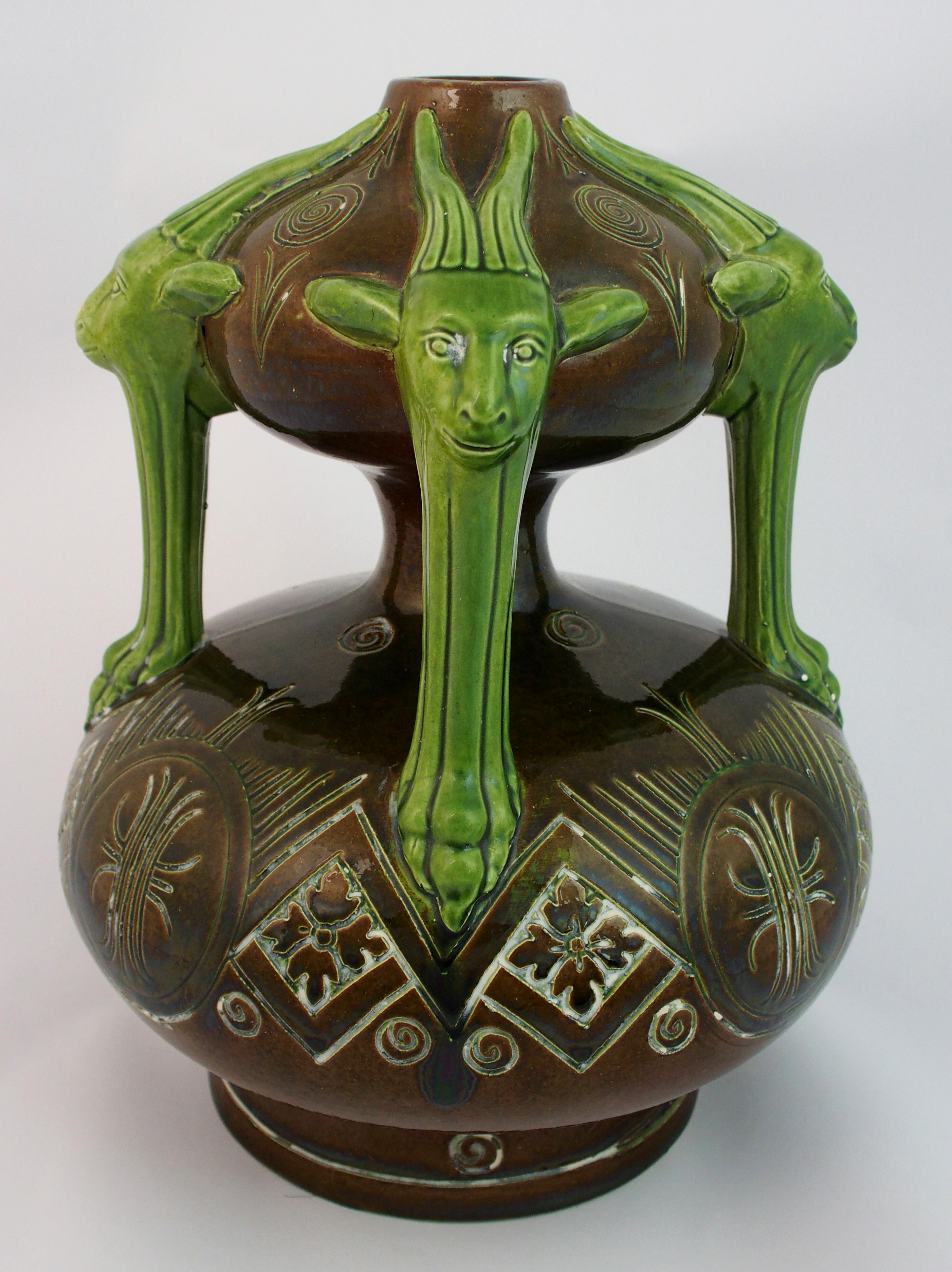 A rare Christopher Dresser "Goats Head" pottery vase designed for ...