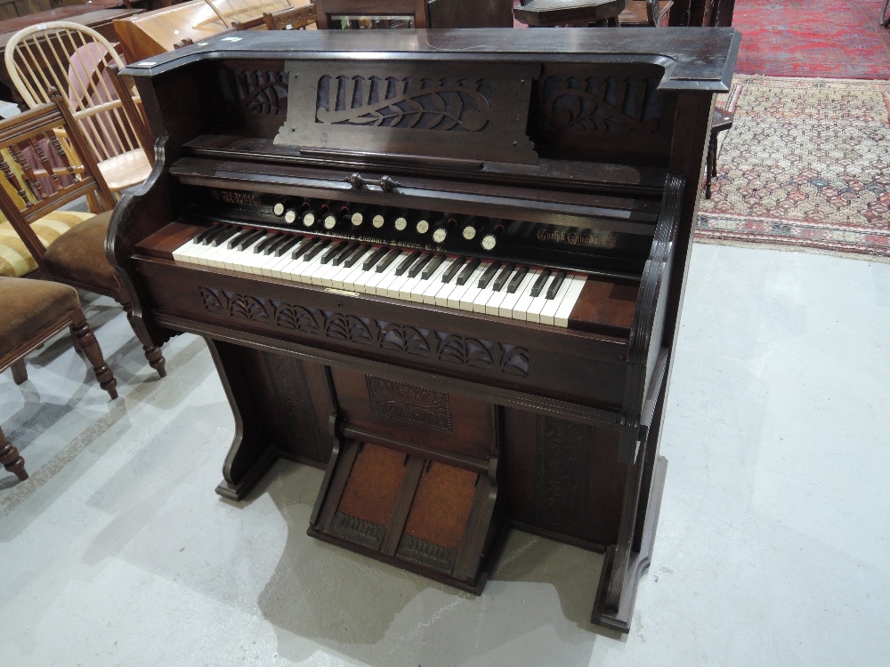 A 19th century stained frame American organ, harmonium of typical ...