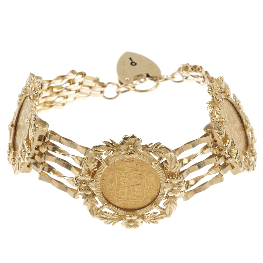 A 9ct gold mounted half sovereign gate bracelet. Designed as a series ...