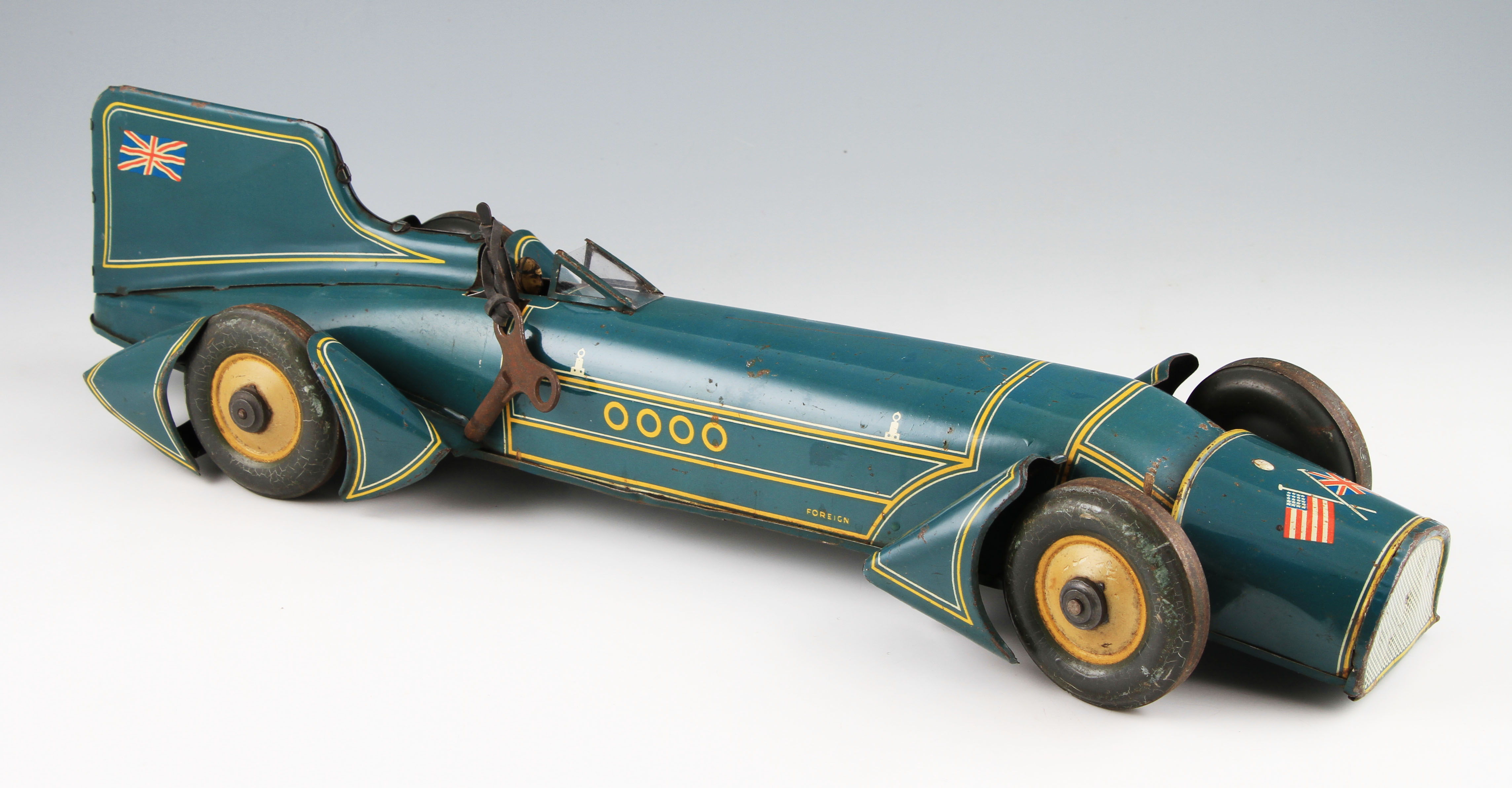 A 1930's tin plate clockwork model of Bluebird land speed record car by ...