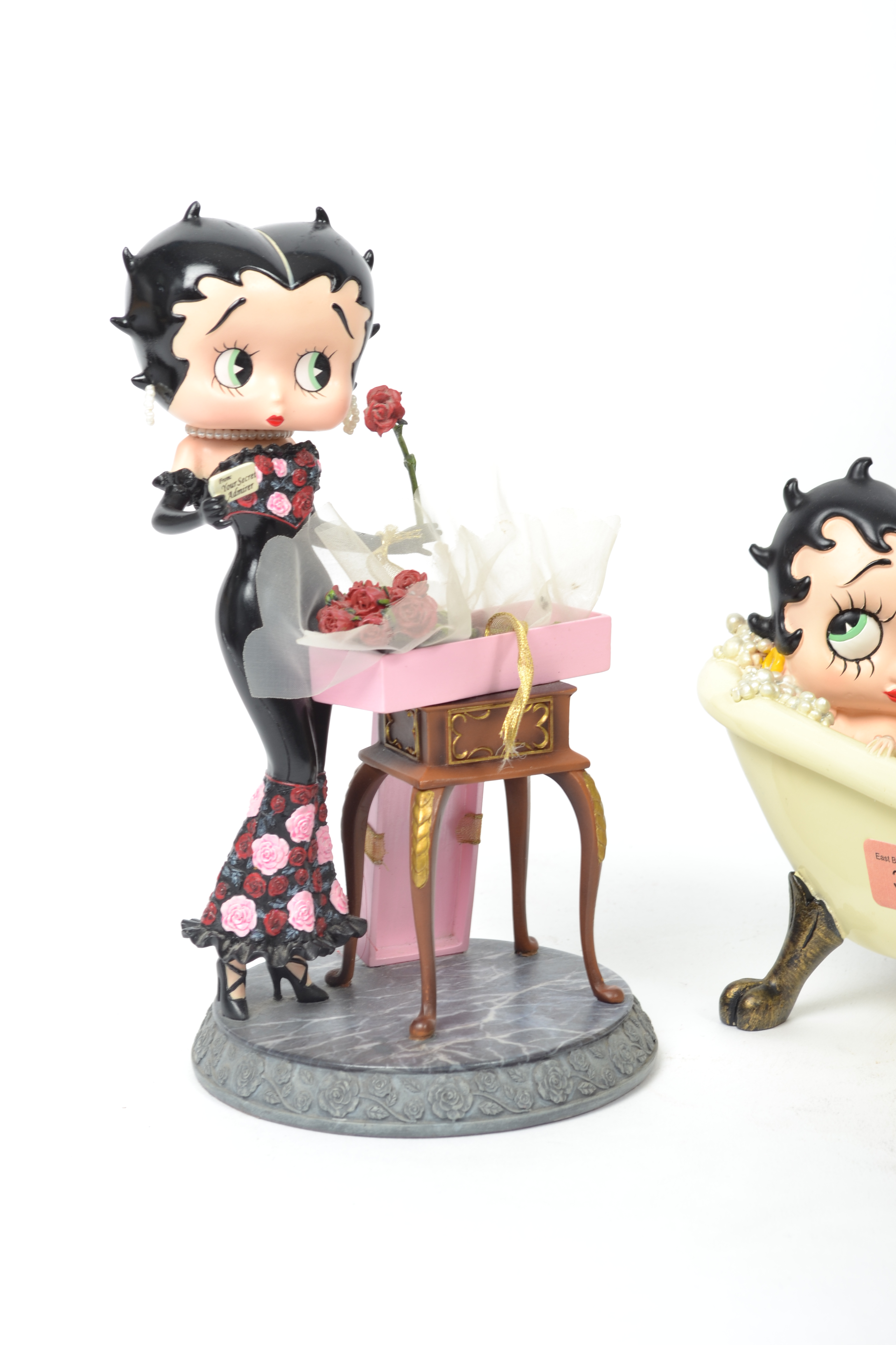 A vintage Betty Boop figurine featuring the iconic character in a bath ...