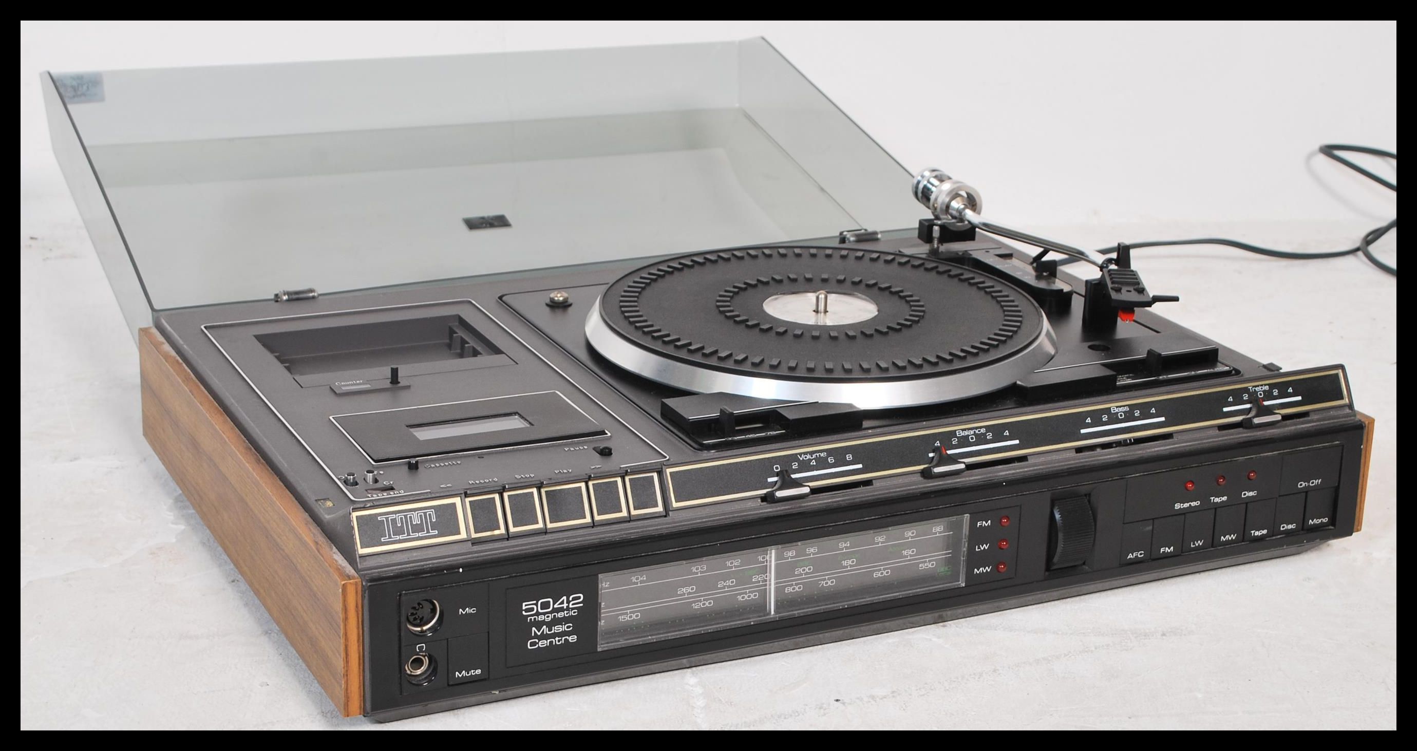 A retro 20th Century ITT 5042 Stereo Music Centre, smoked perspex lift ...