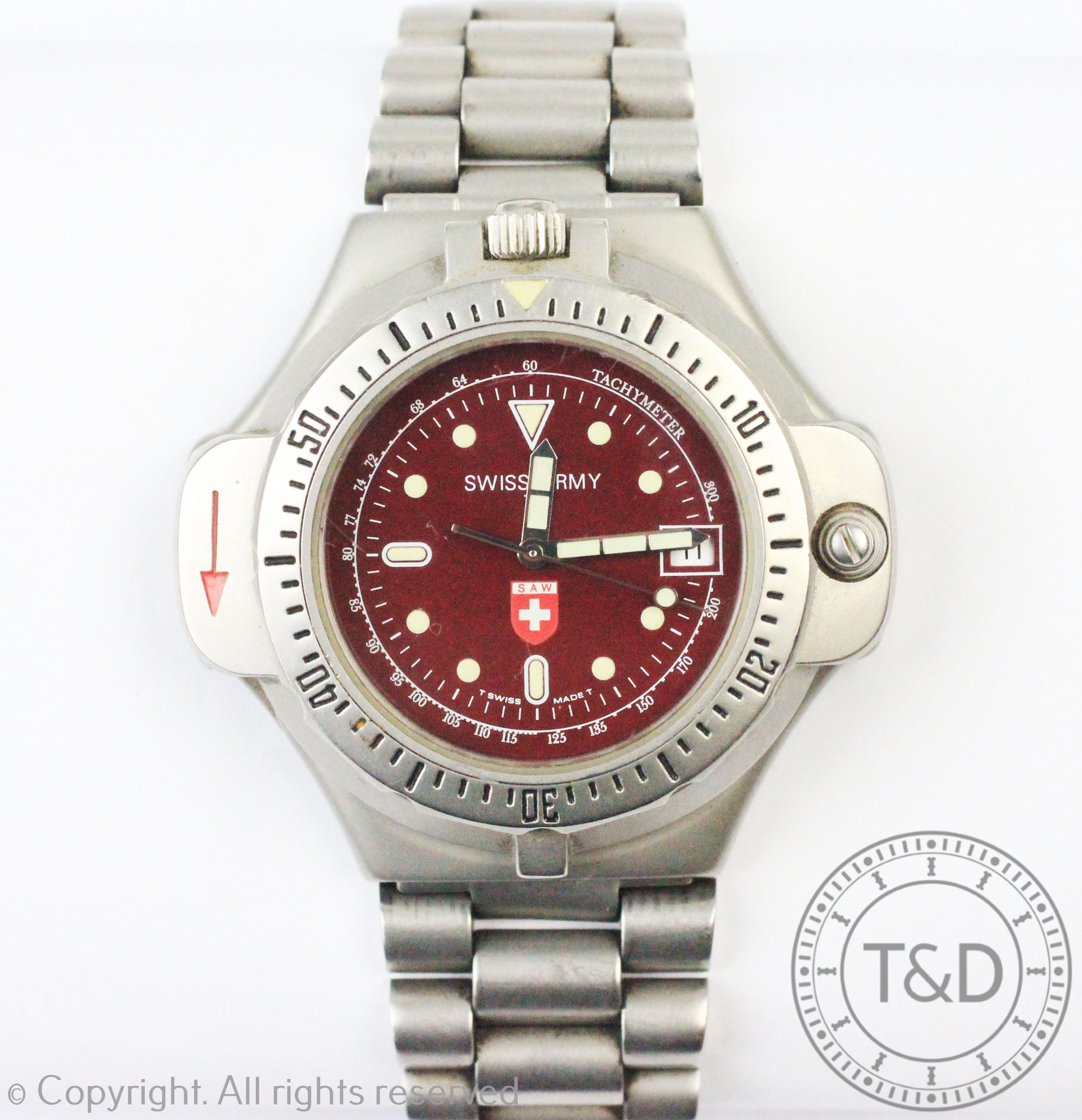 A Swiss Army compass watch, the stainless steel case enclosing claret ...