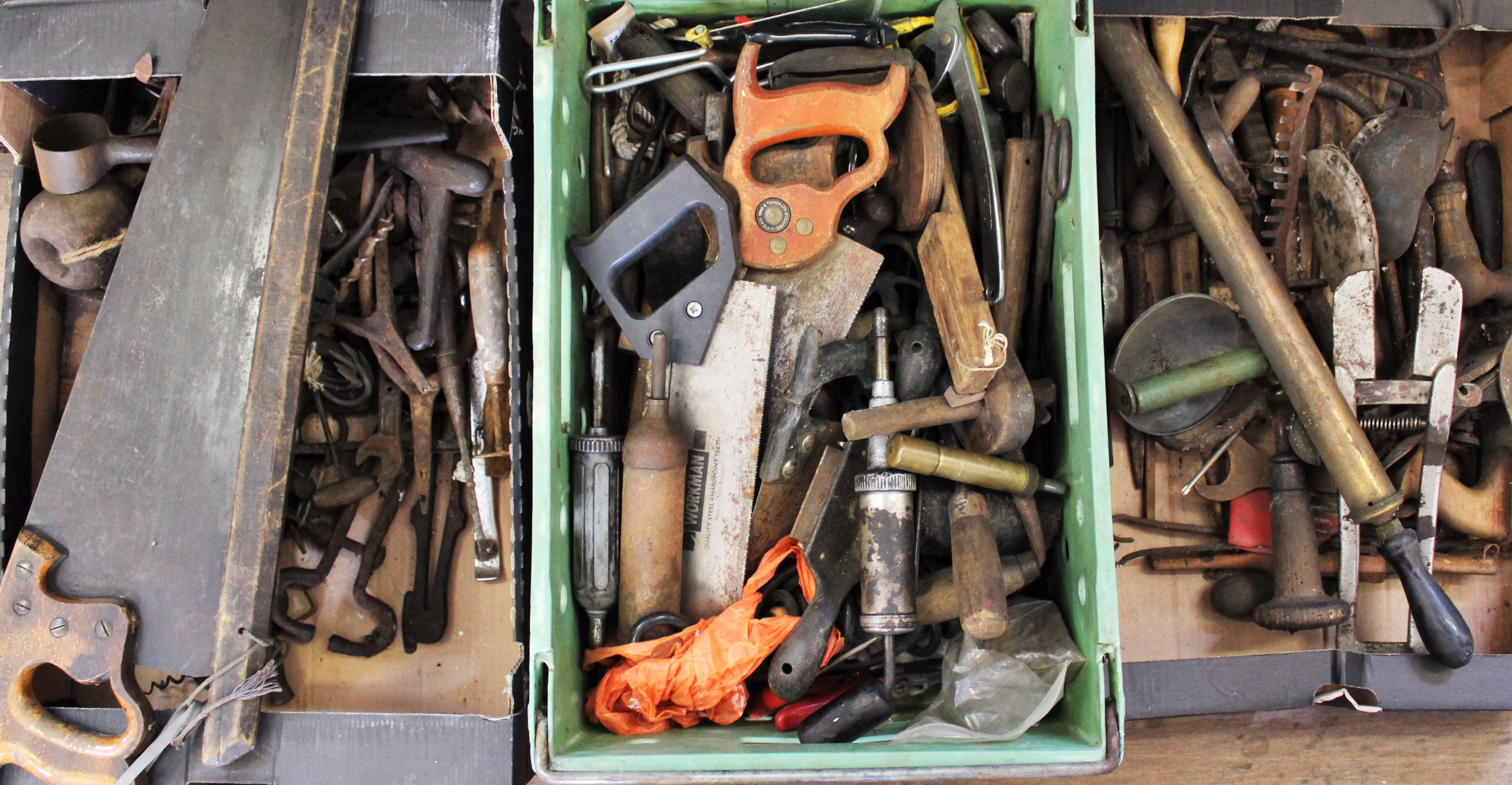A selection of 19th century and later vintage hand tools and farming ...