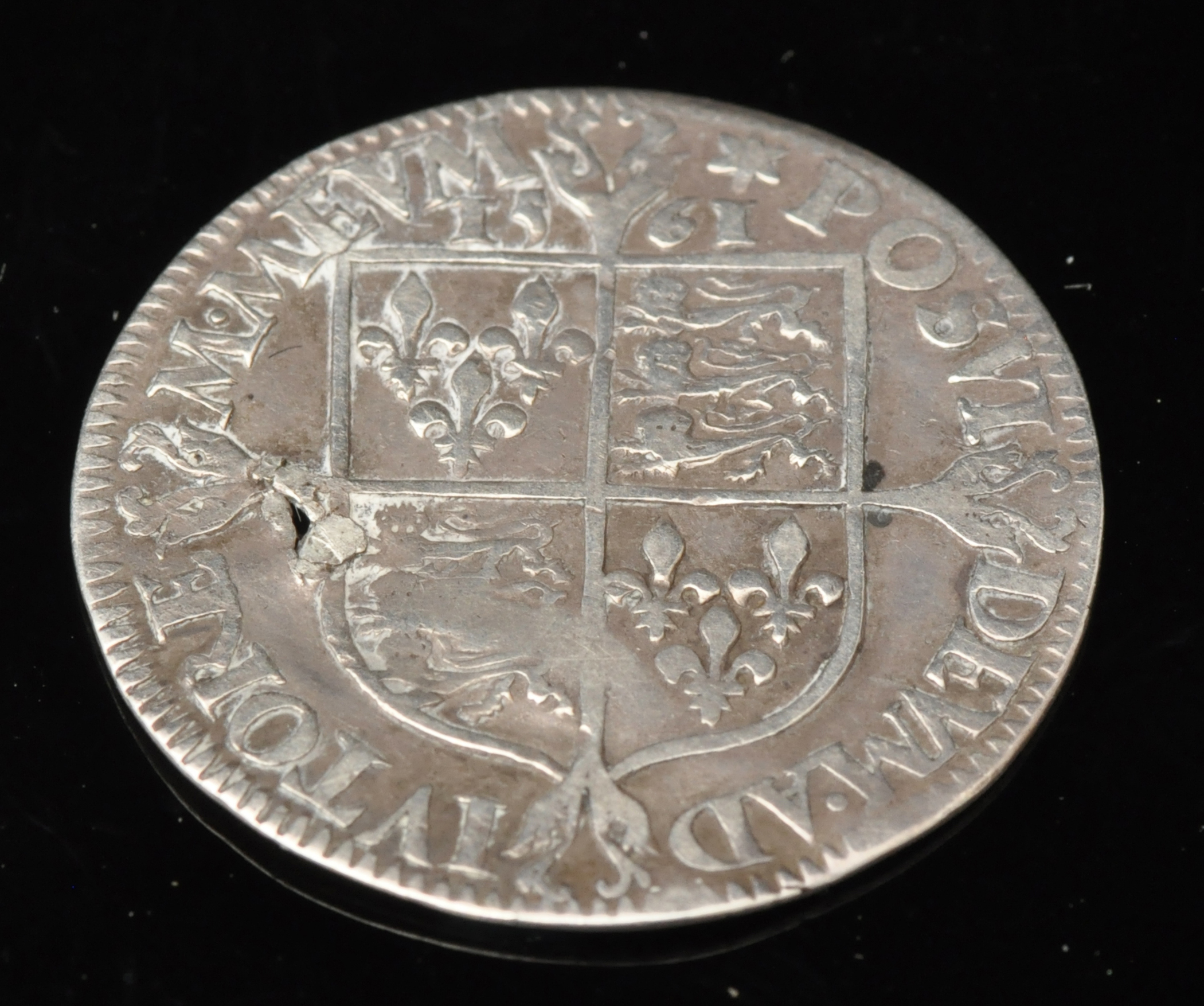 An Elizabeth I milled sixpence, 1561, m.m. Star, S2593. (holed)