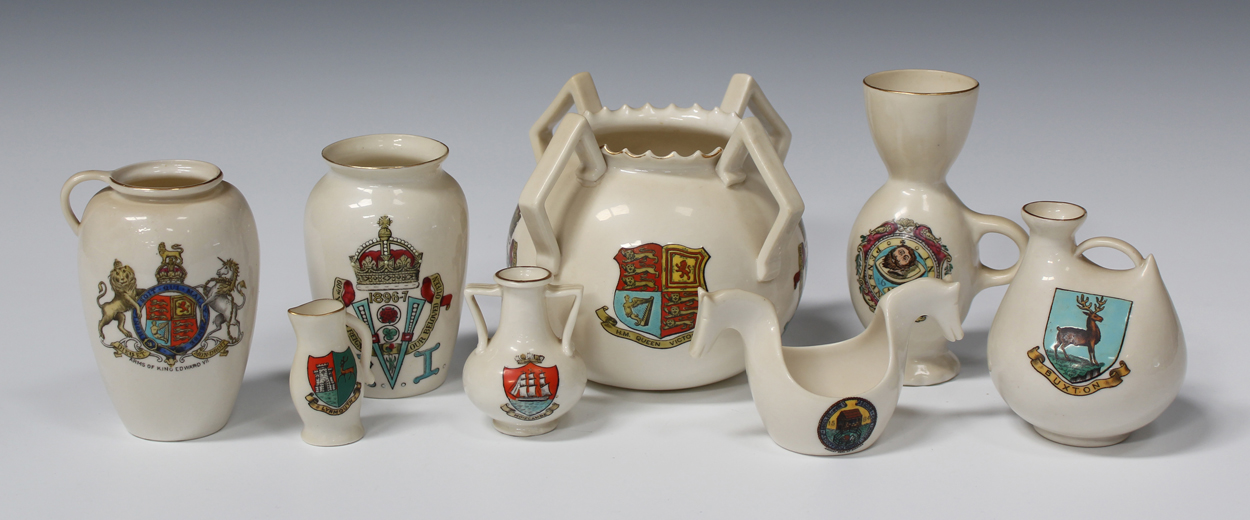 A large collection of W.H. Goss crested china, including a four-handled ...