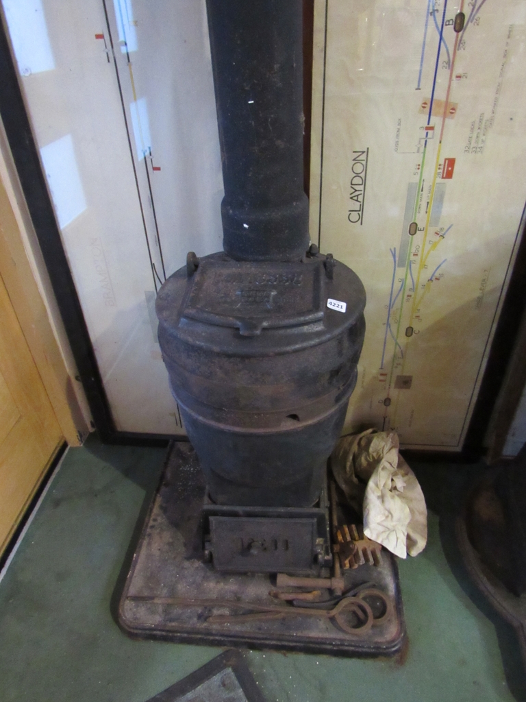 A Romesse cast iron signal box stove with chimney, reputedly from ...