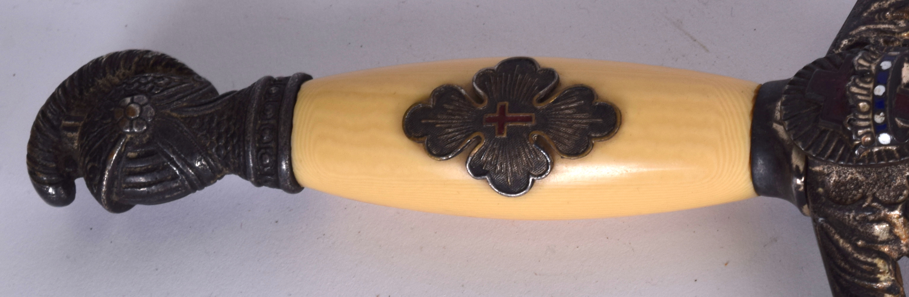 AN ANTIQUE MASONIC IVORY HANDLED SWORD, formed with knight helmet ...
