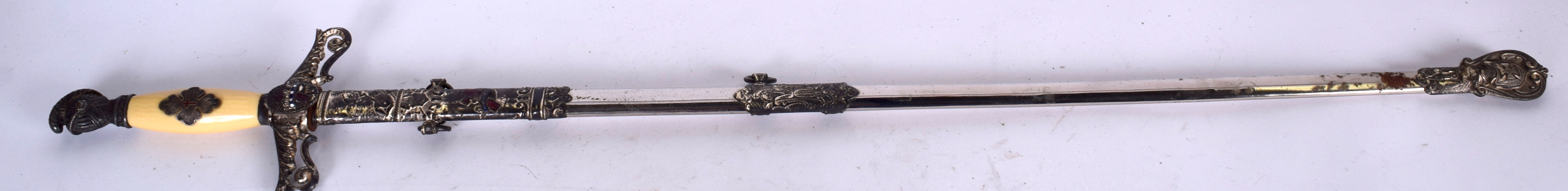 AN ANTIQUE MASONIC IVORY HANDLED SWORD, formed with knight helmet ...