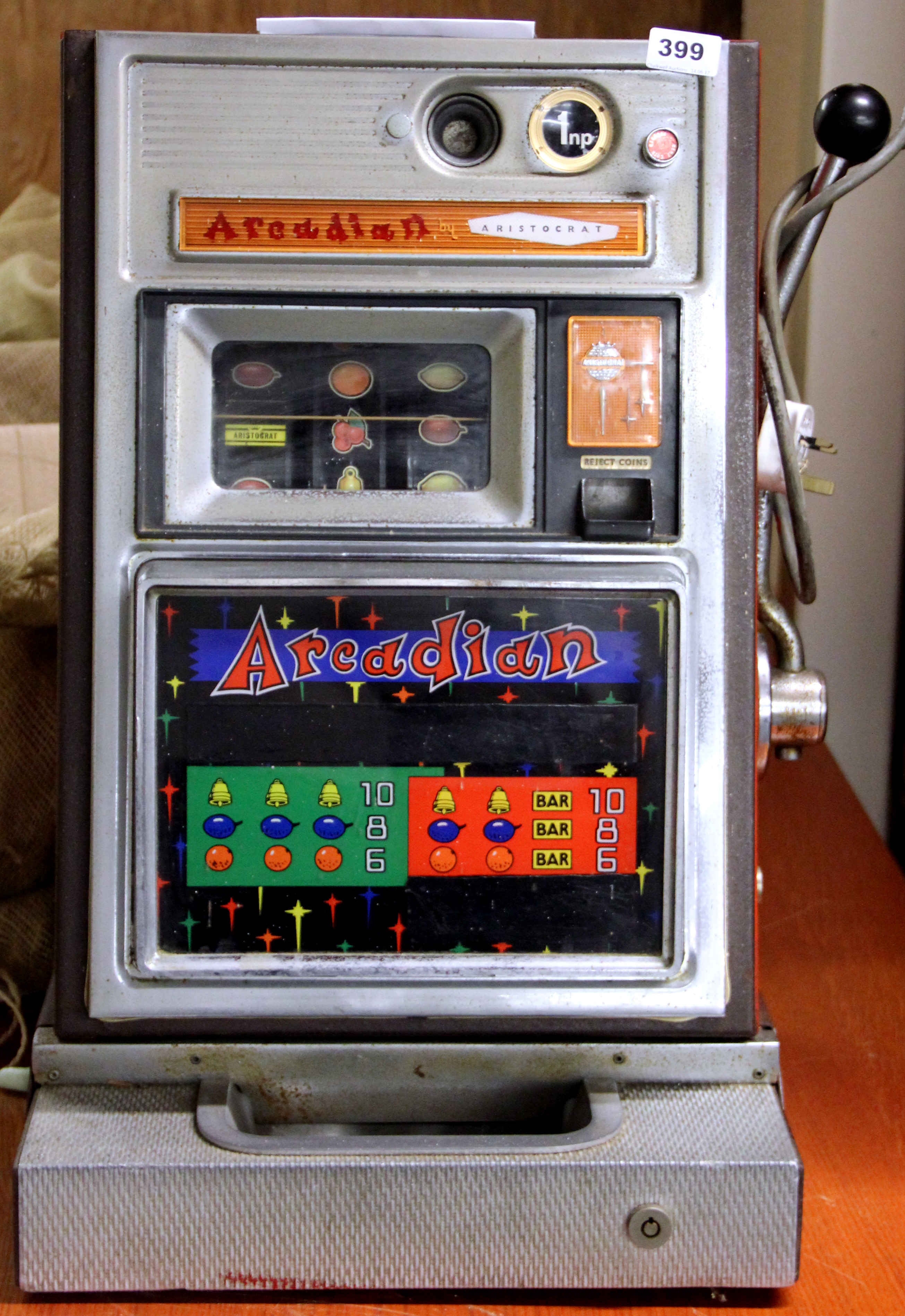 A vintage arcade fruit machine, H. 63cm.