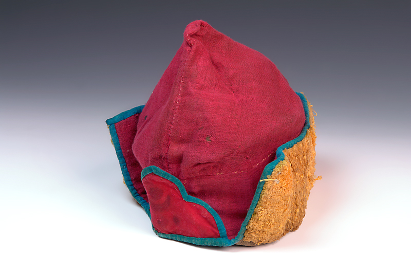 FOUR TIBETAN HATS, including black velvet monk’s hat and Kagyu hat. The ...