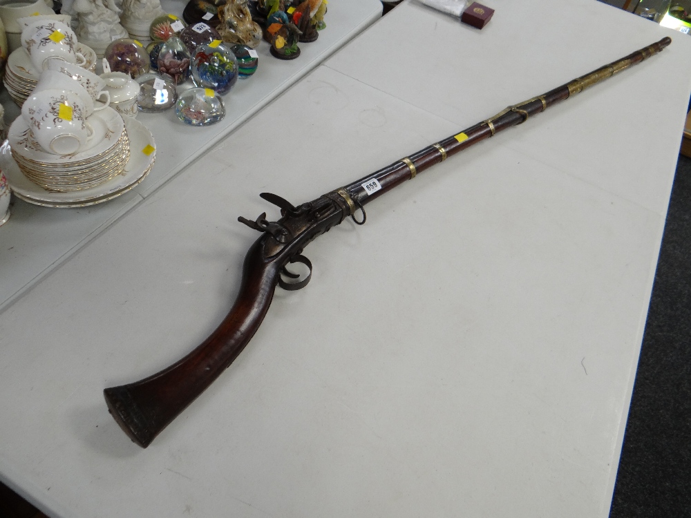 A nineteenth century believed Turkish musket with decorative brass ...