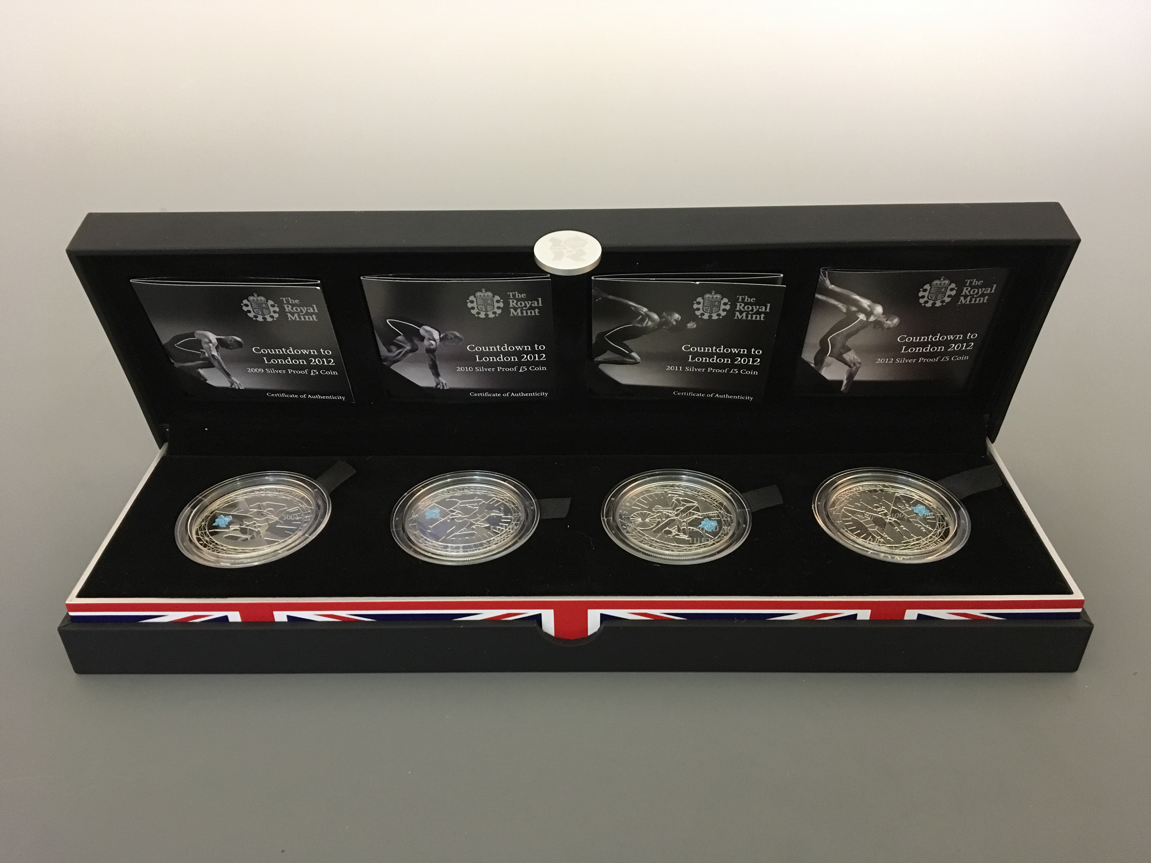 The Royal Mint two Countdown to London 2012 silver proof £5 four coin ...