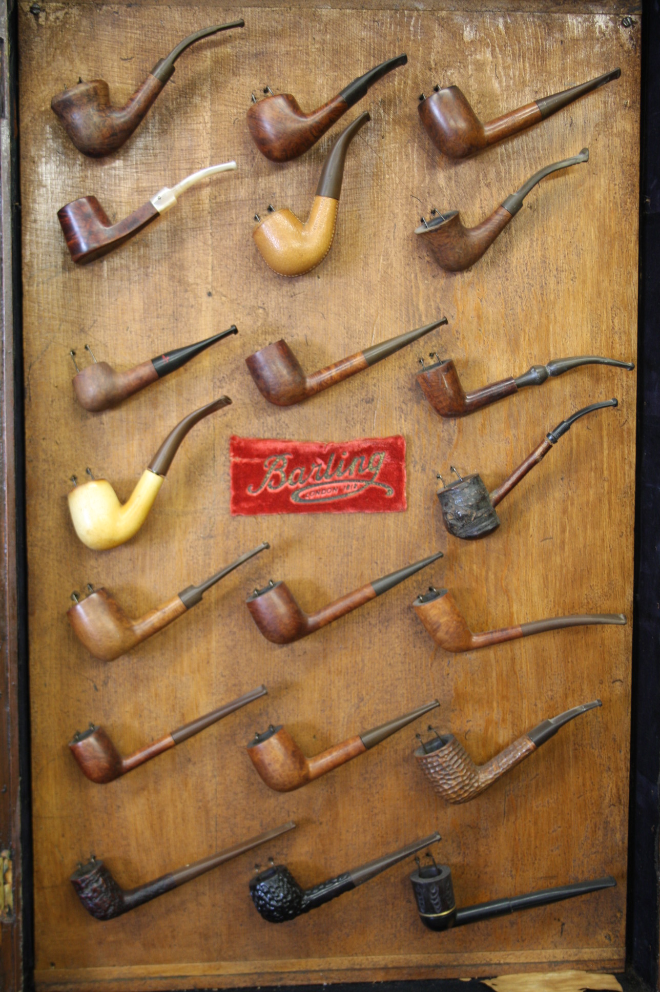A wall mounted pipe display cabinet, a mahogany pipe/tobacco cabinet ...