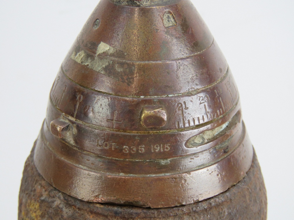 An inert British WWI 18lb high explosive shell with case, dated 1916 ...