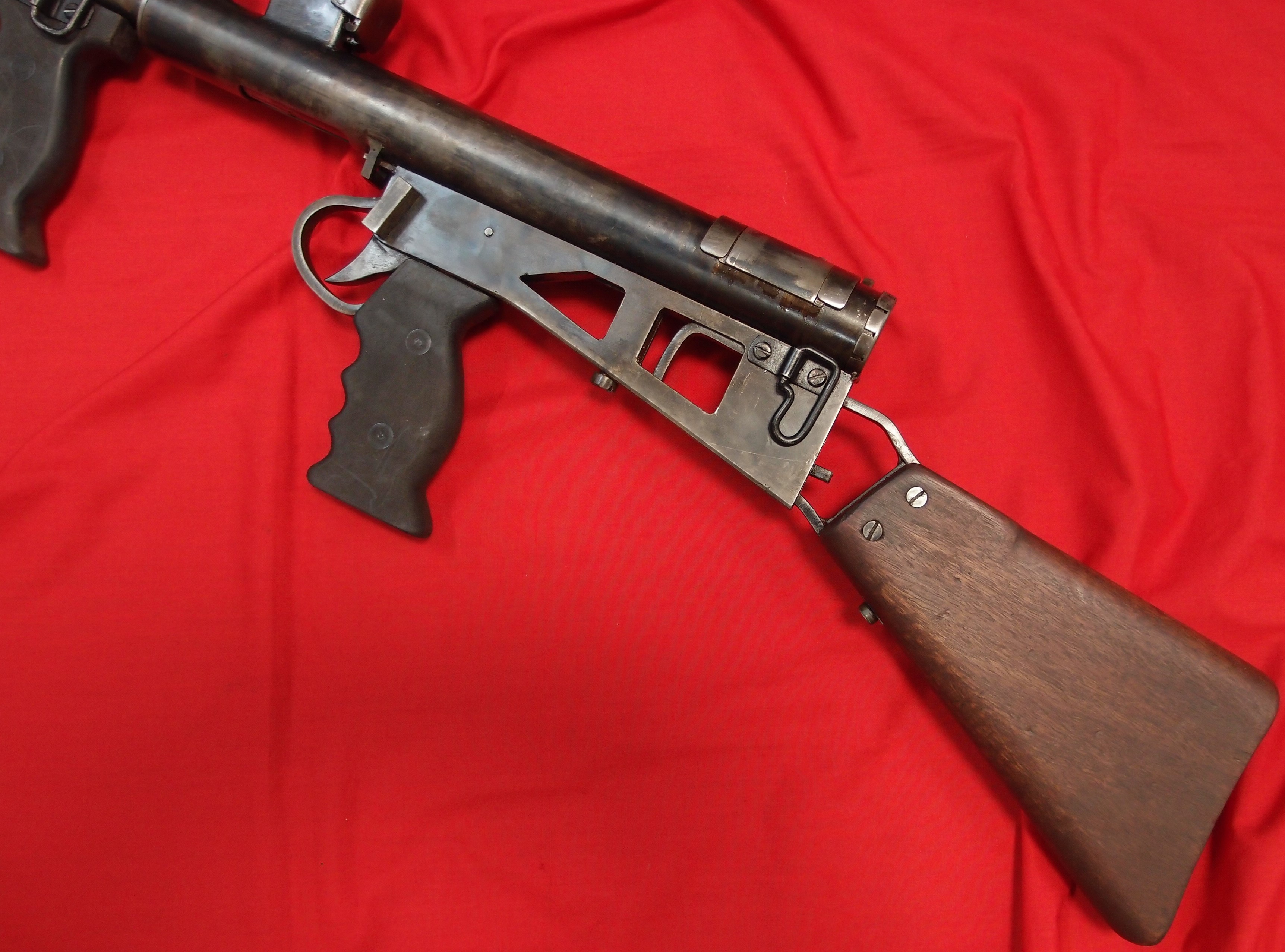 Replica WW2 Australian Owen Sub Machine Gun. Wooden butt stock attached ...