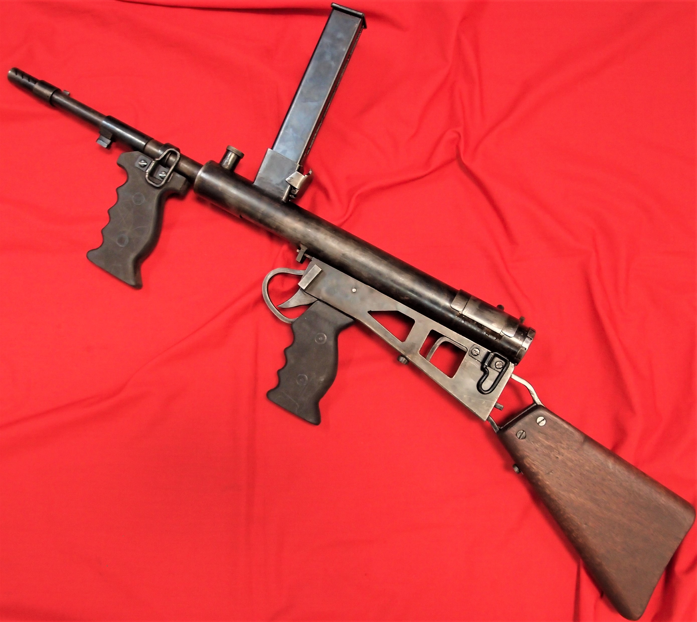 Replica WW2 Australian Owen Sub Machine Gun. Wooden butt stock attached ...
