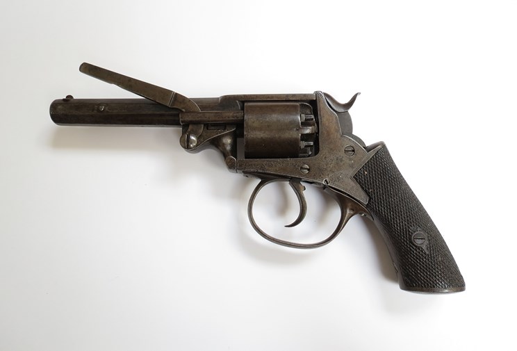 A circa 1870 percussion revolver with octagonal faceted barrel, six ...