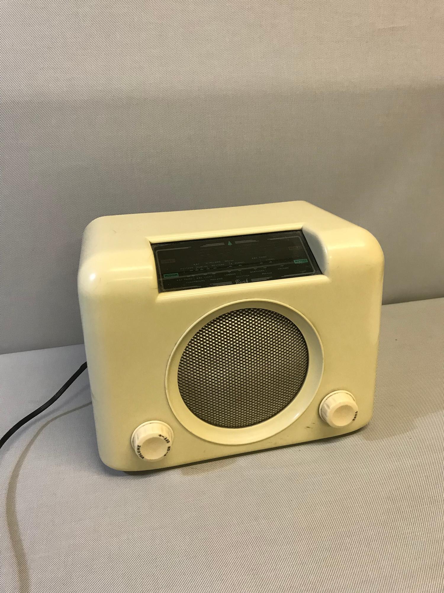 A Vintage Bush radio fitted with a white Bakelite body working oder