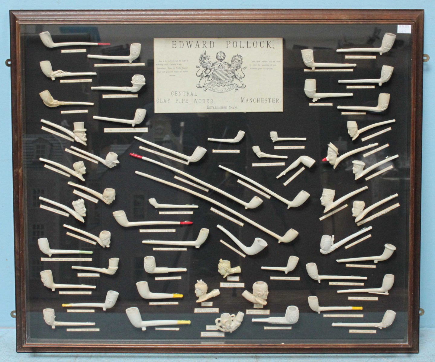 A collection of 54 mounted clay pipes from Edward Pollock clay pipe ...
