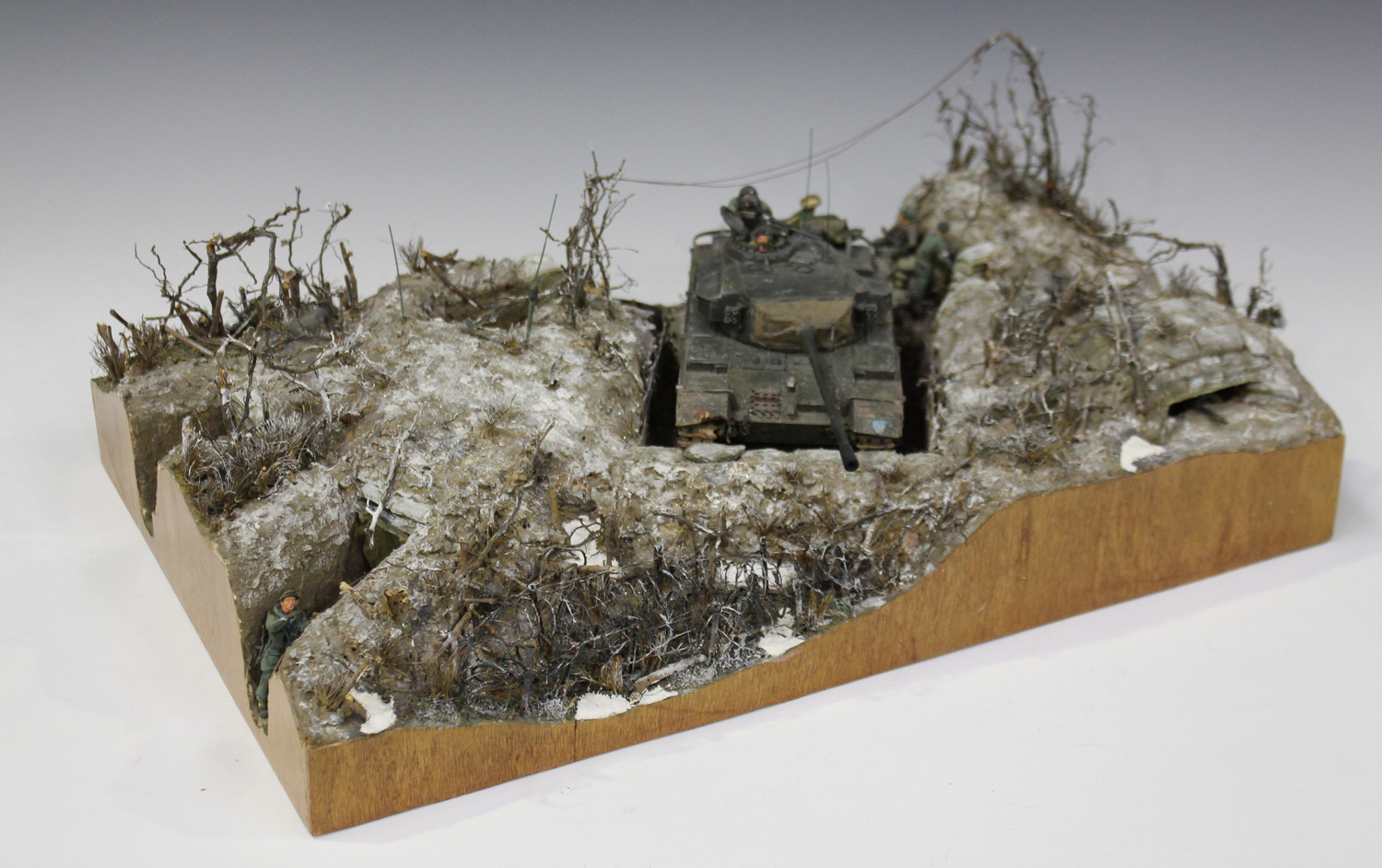 A diorama depicting a Korean battle scene with entrenched tank and ...