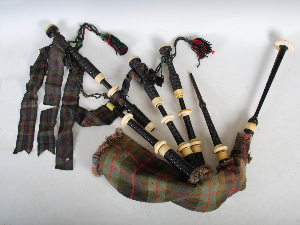 A set of ivory mounted bagpipes P. HENDERSON GLASGOW, with green tartan ...