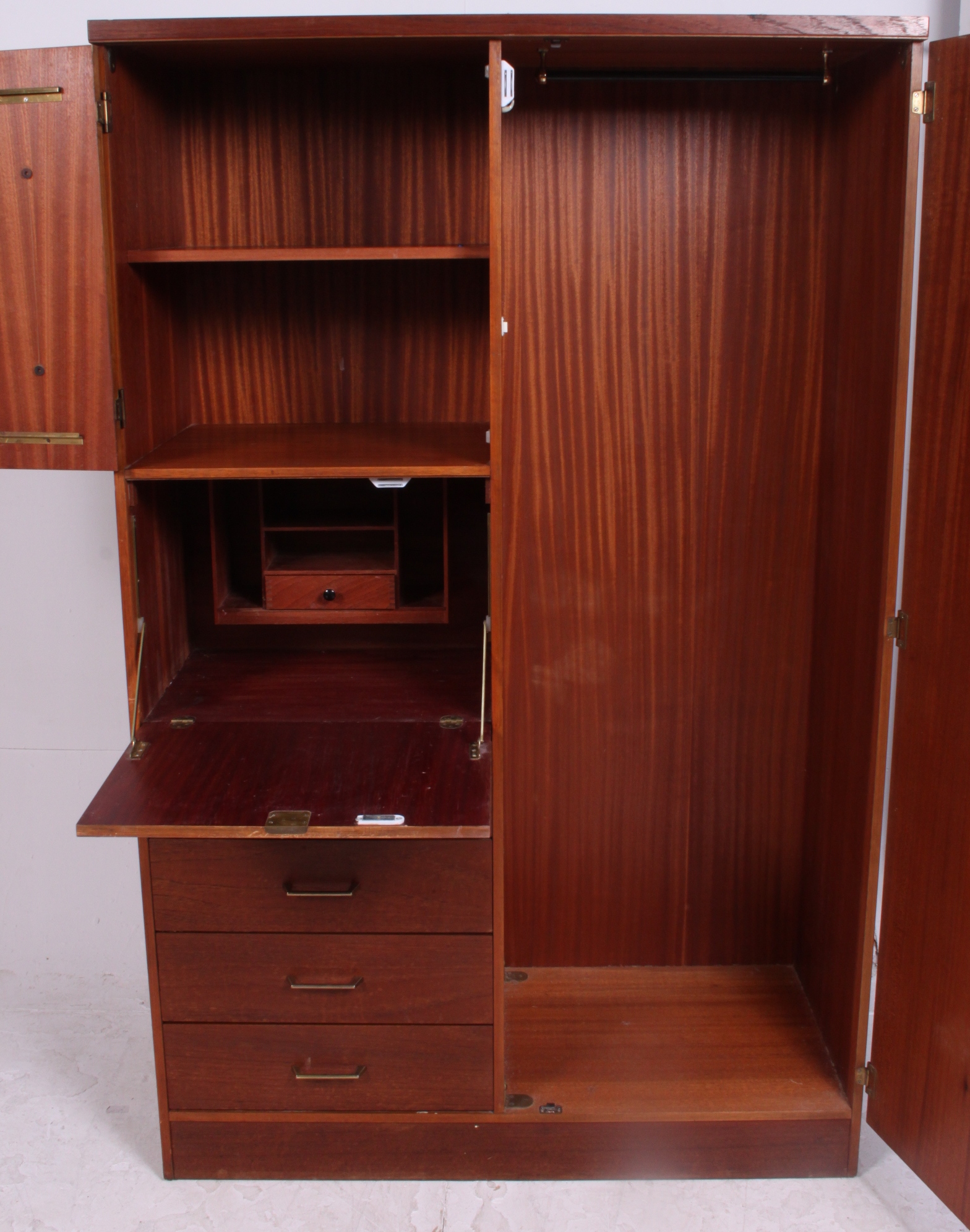 A retro 1960's Austinsuite teak wood compactum wardrobe armoire. The ...