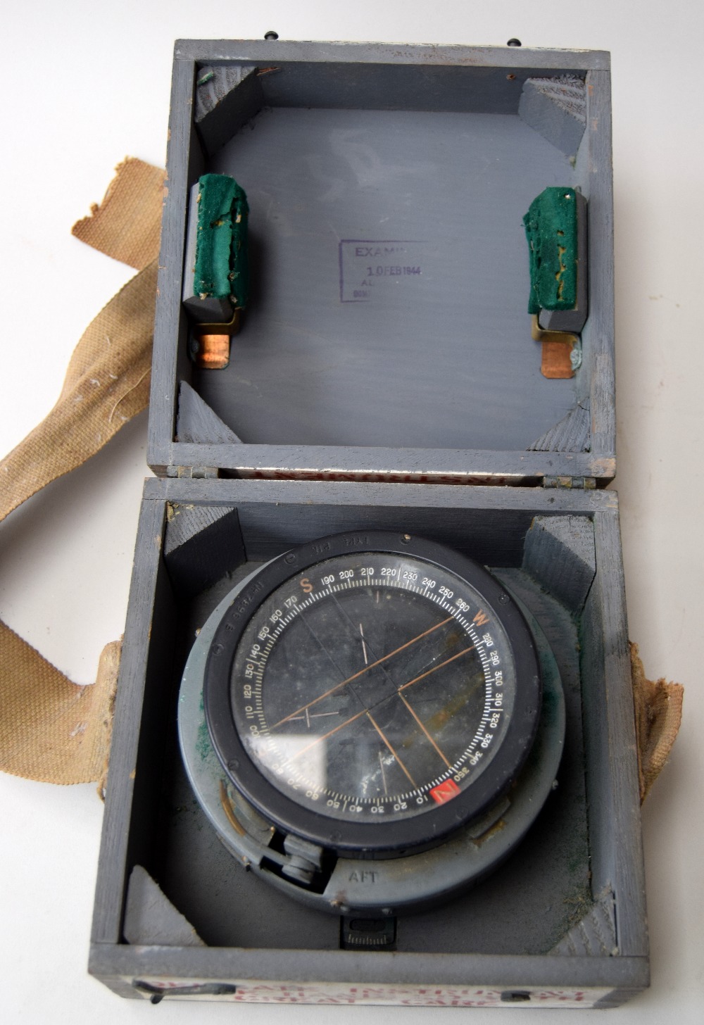 A Royal Air Force P11 aircraft compass, circa 1944, in wooden case of ...