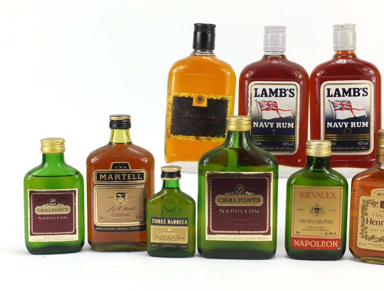 Eleven bottles of French brandy and rum including Hennessey Cognac ...