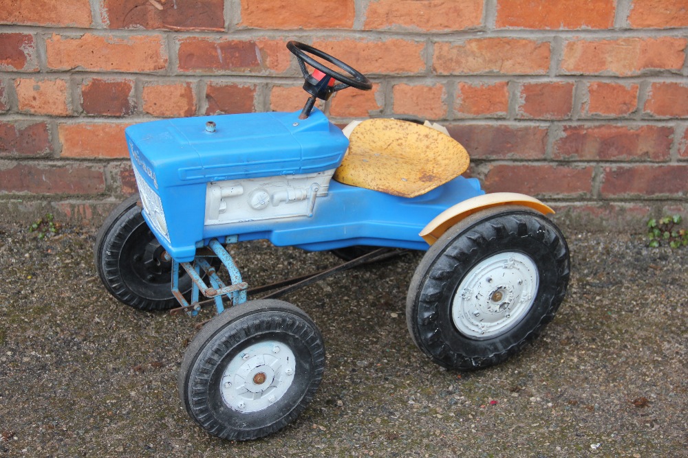 A childs Tri-ang ride-on blue tractor and yellow trailer and a Raleigh ...