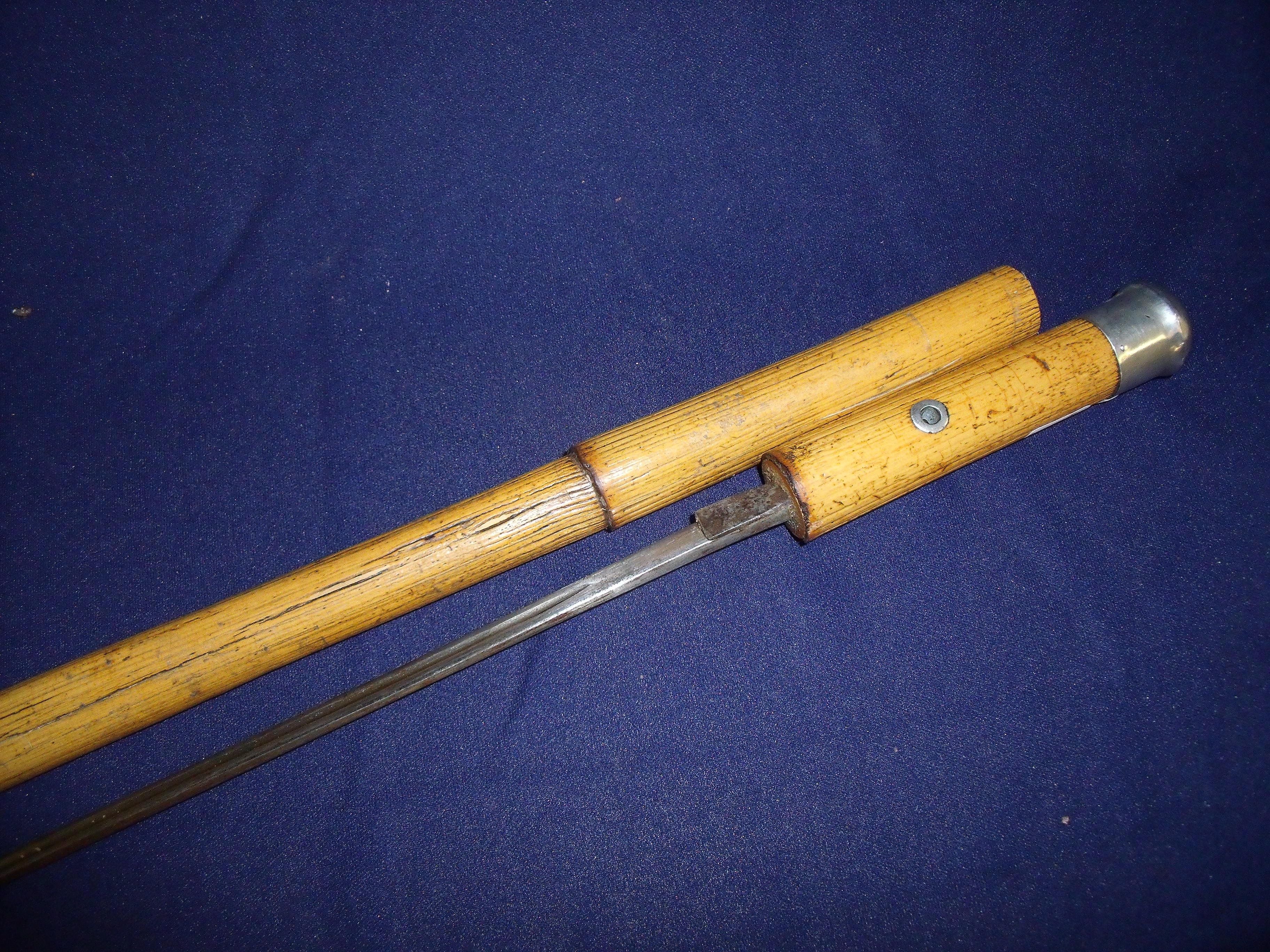 Late Victorian bamboo sword cane with white metal mounts and 28.5inch blade (overall length 89cm)