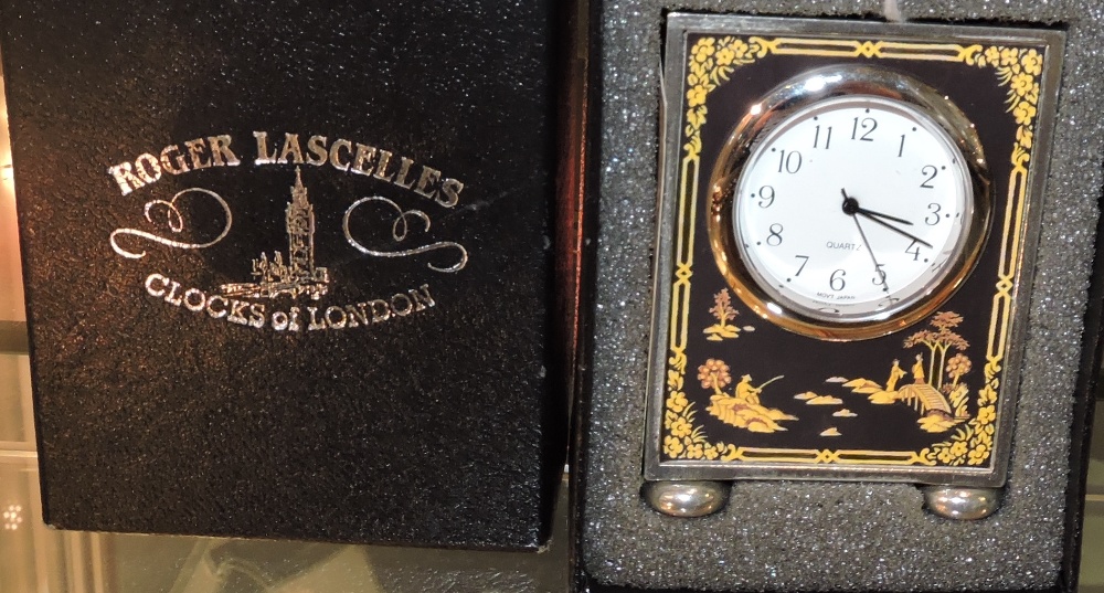 A Roger Lascelles miniature carriage clock, boxed. H. 6.5cm