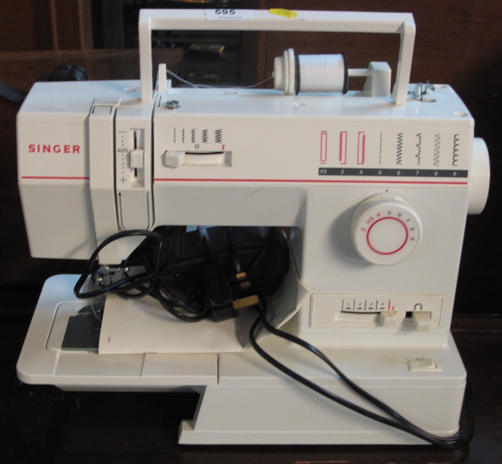Electric Singer sewing machine (model 9015).