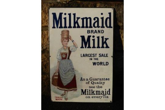 A Milkmaid Brand Milk pictorial enamel sign by Chromo, with some ...
