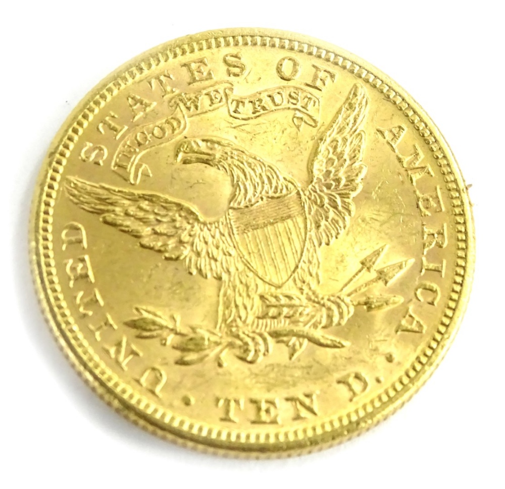 An 1895 American gold 10 dollar coin.