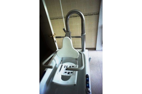 an Arjo Malibu electrically operated rise and fall patient bath with ...