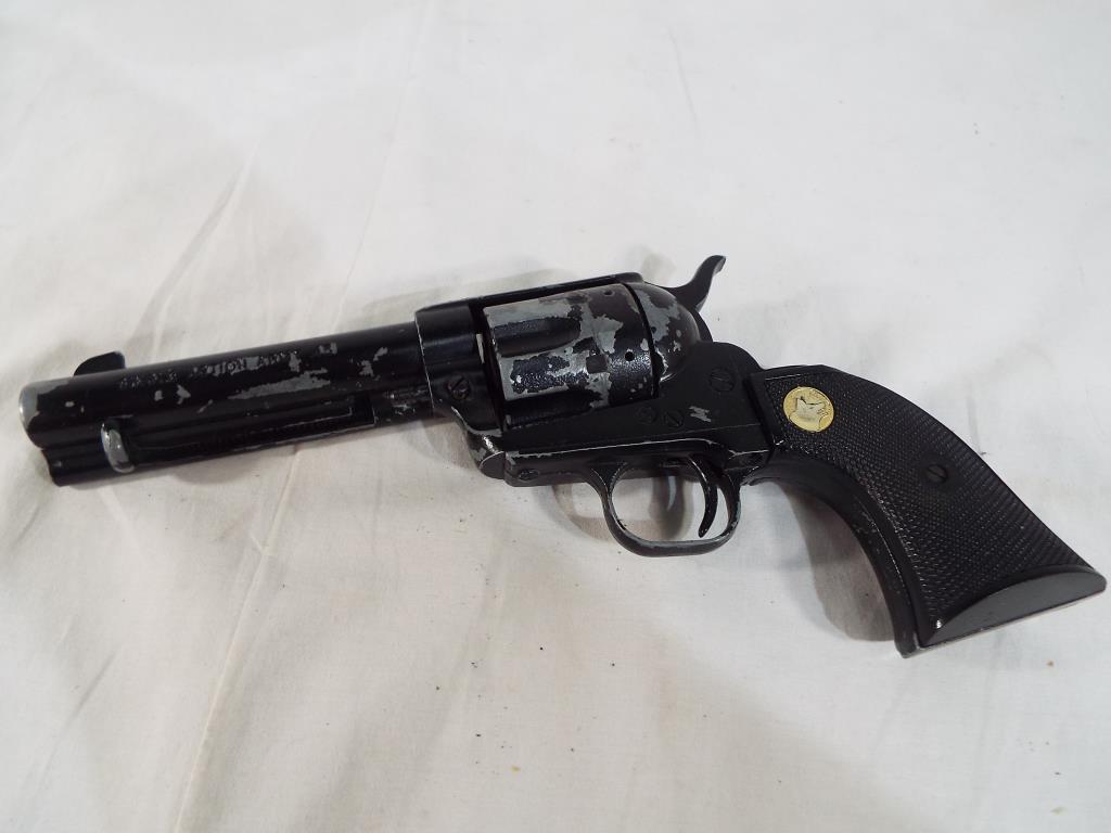 A replica pistol marked Sussex Armoury and single action army .45 with ...