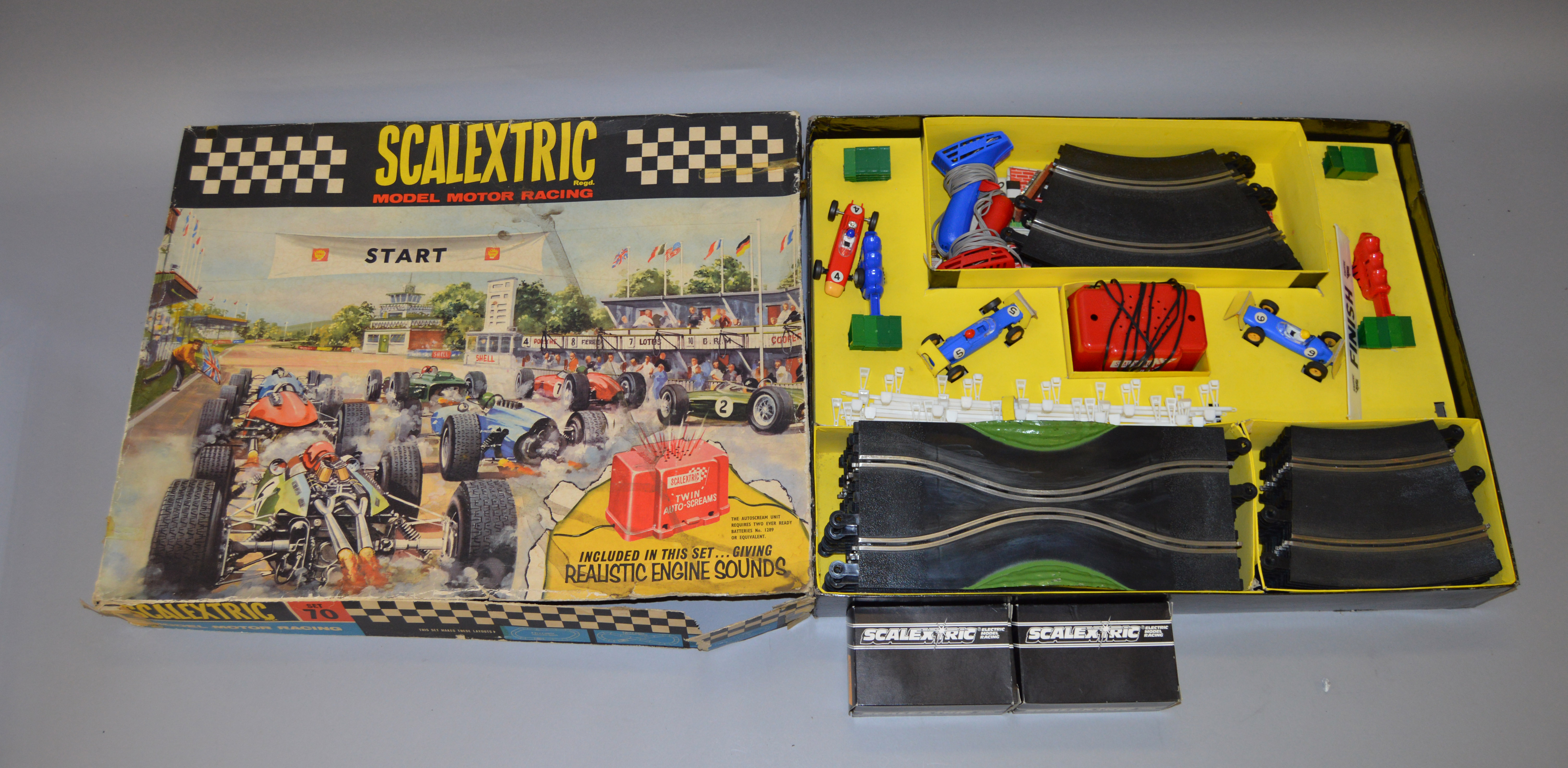 Scalextric Set No. 70 including 3 cars together with 2 No. C265 Hand ...